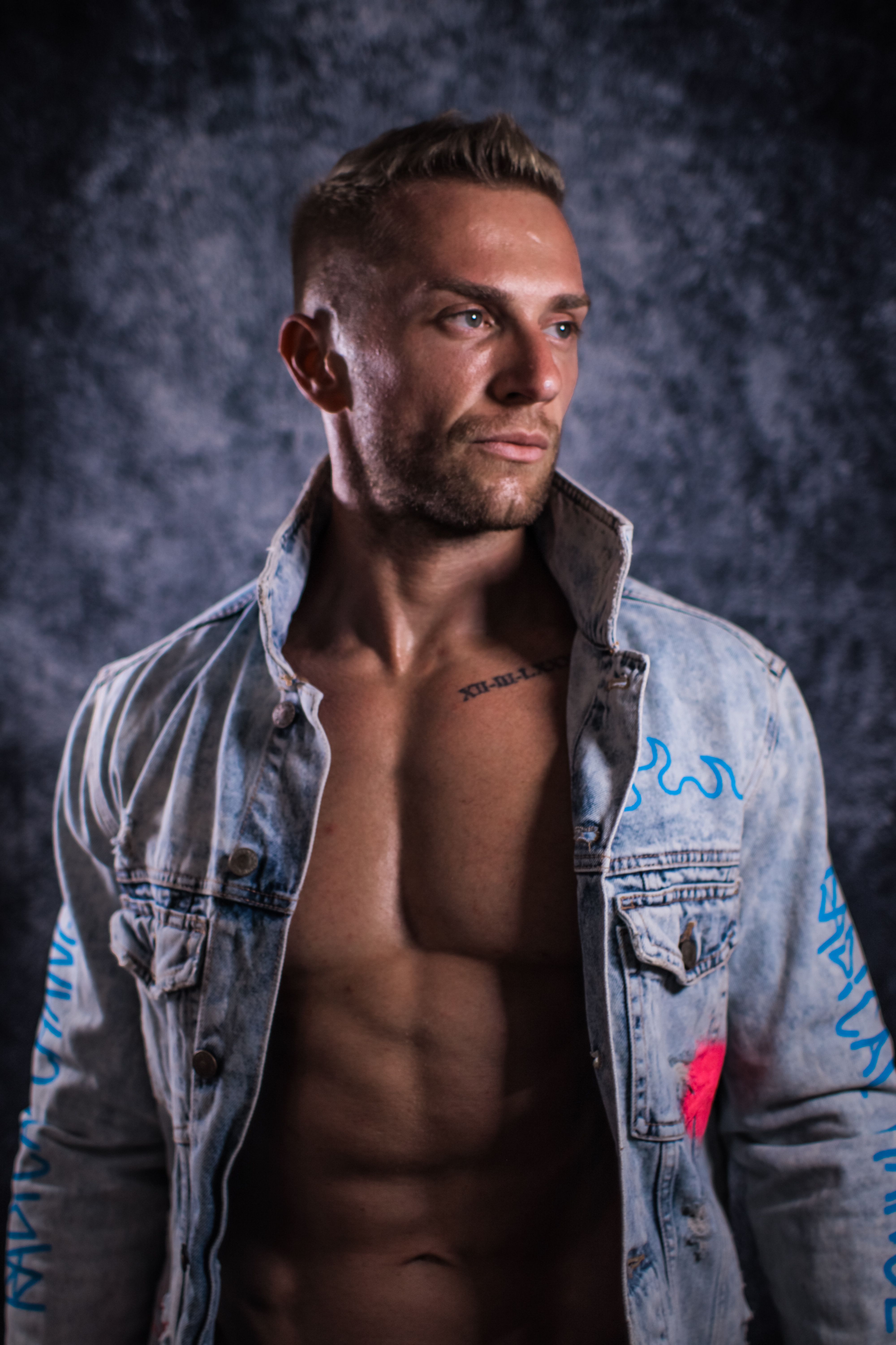 Close-Up Shot of a Man Wearing a Denim Jacket · Free Stock Photo
