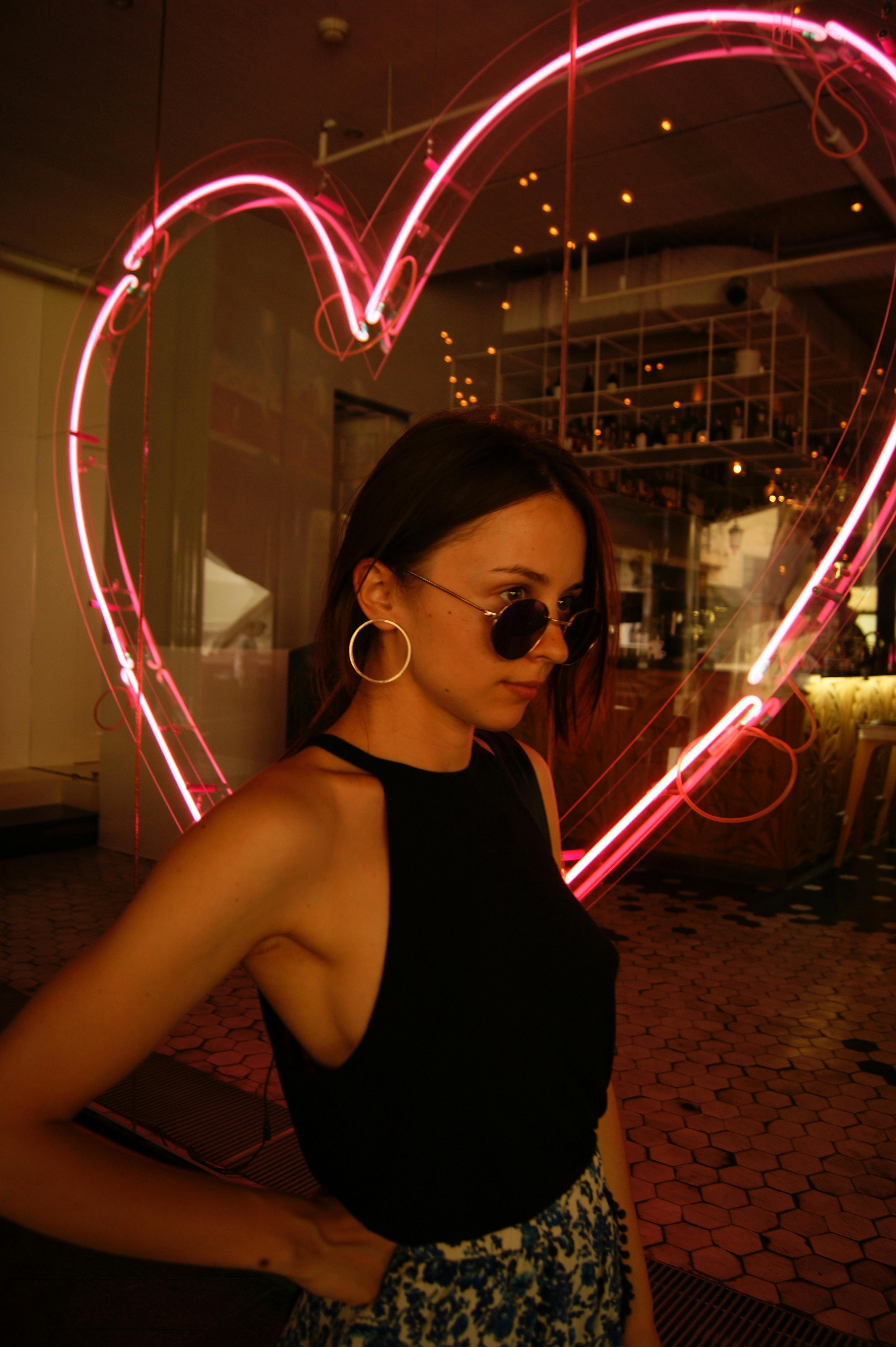 Woman in Black Tank Top Wearing Black Framed Eyeglasses · Free Stock Photo
