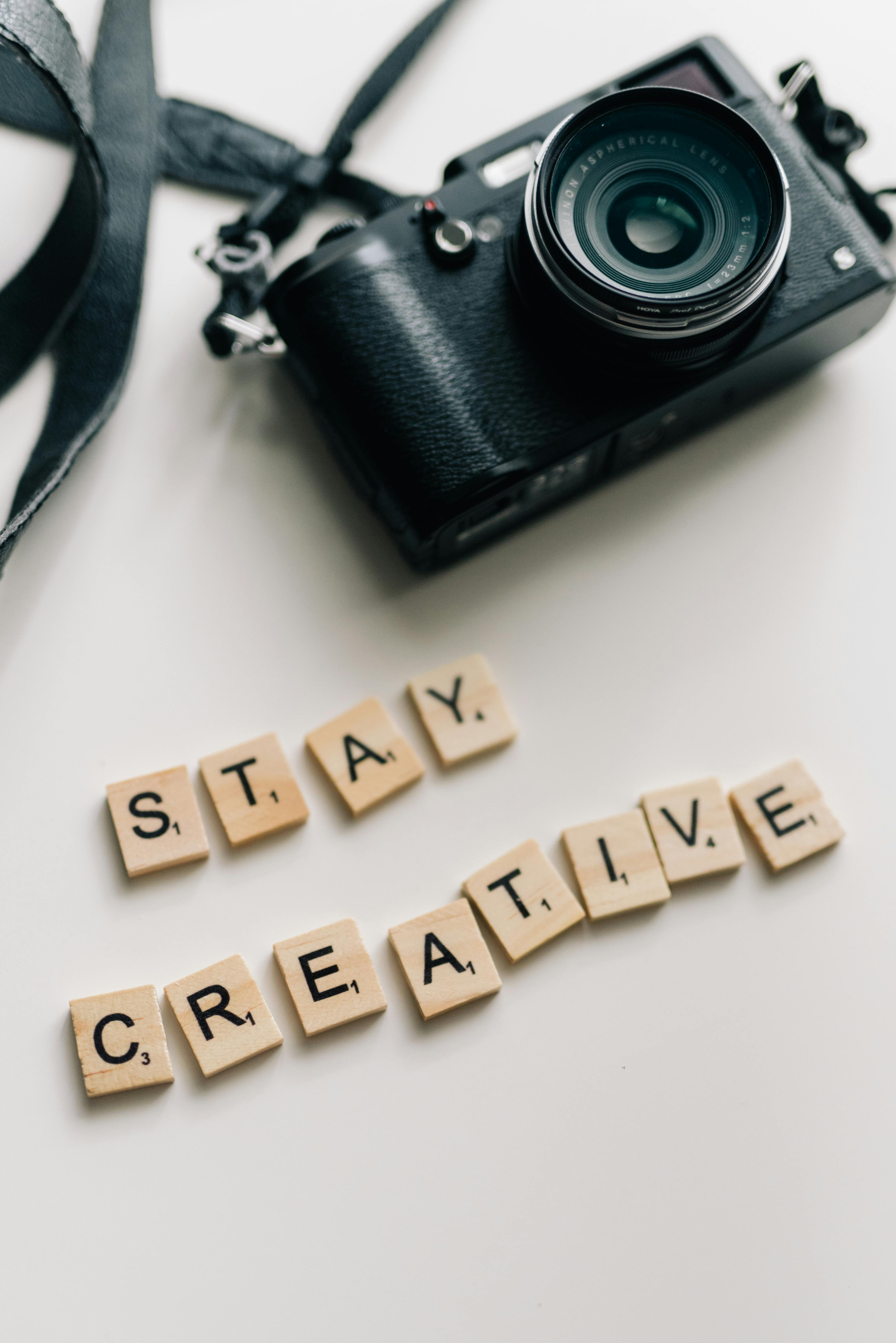 Close-Up Shot of Scrabble Tiles on a White Surface · Free Stock Photo