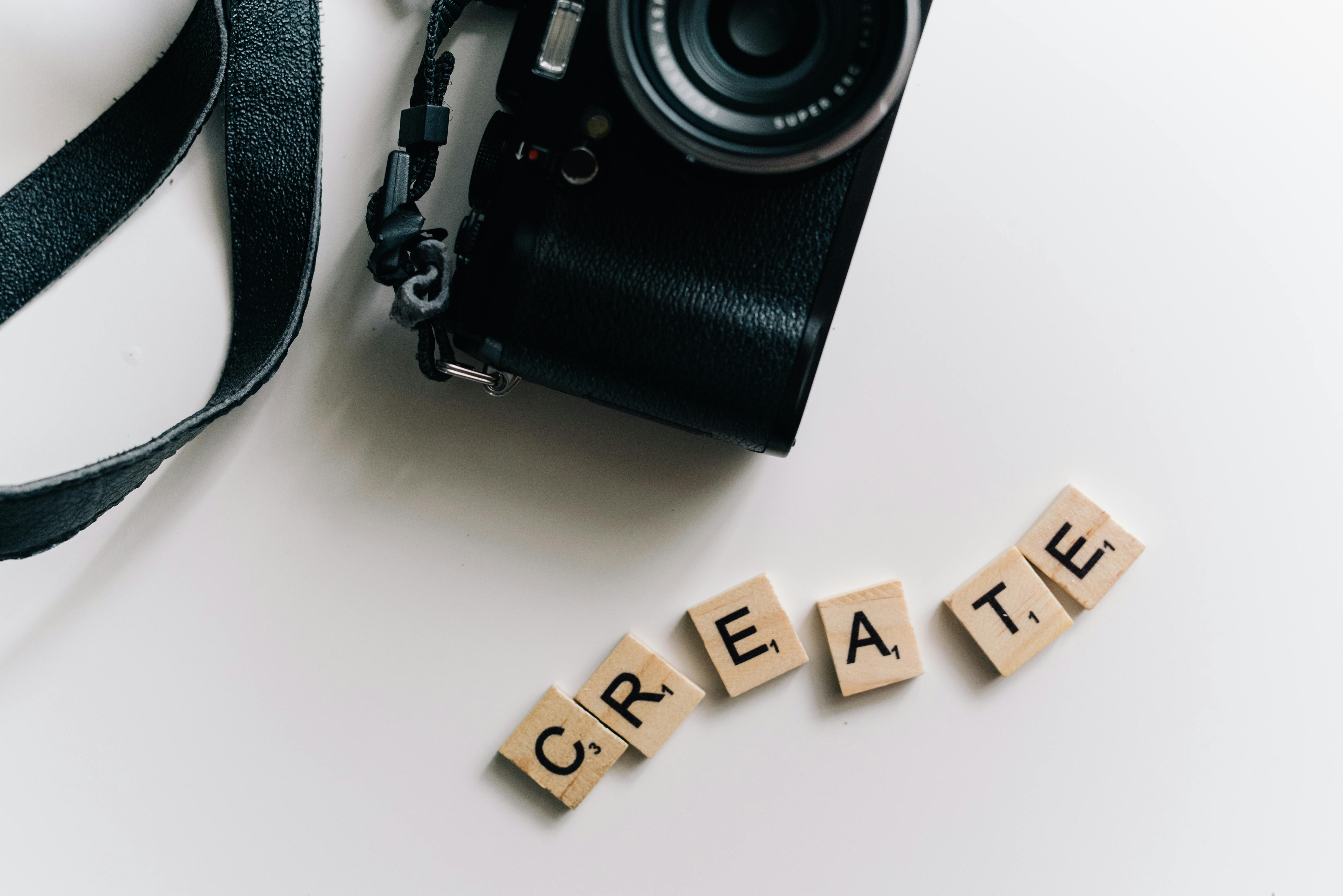 Close-Up Shot of Scrabble Tiles on a White Surface · Free Stock Photo