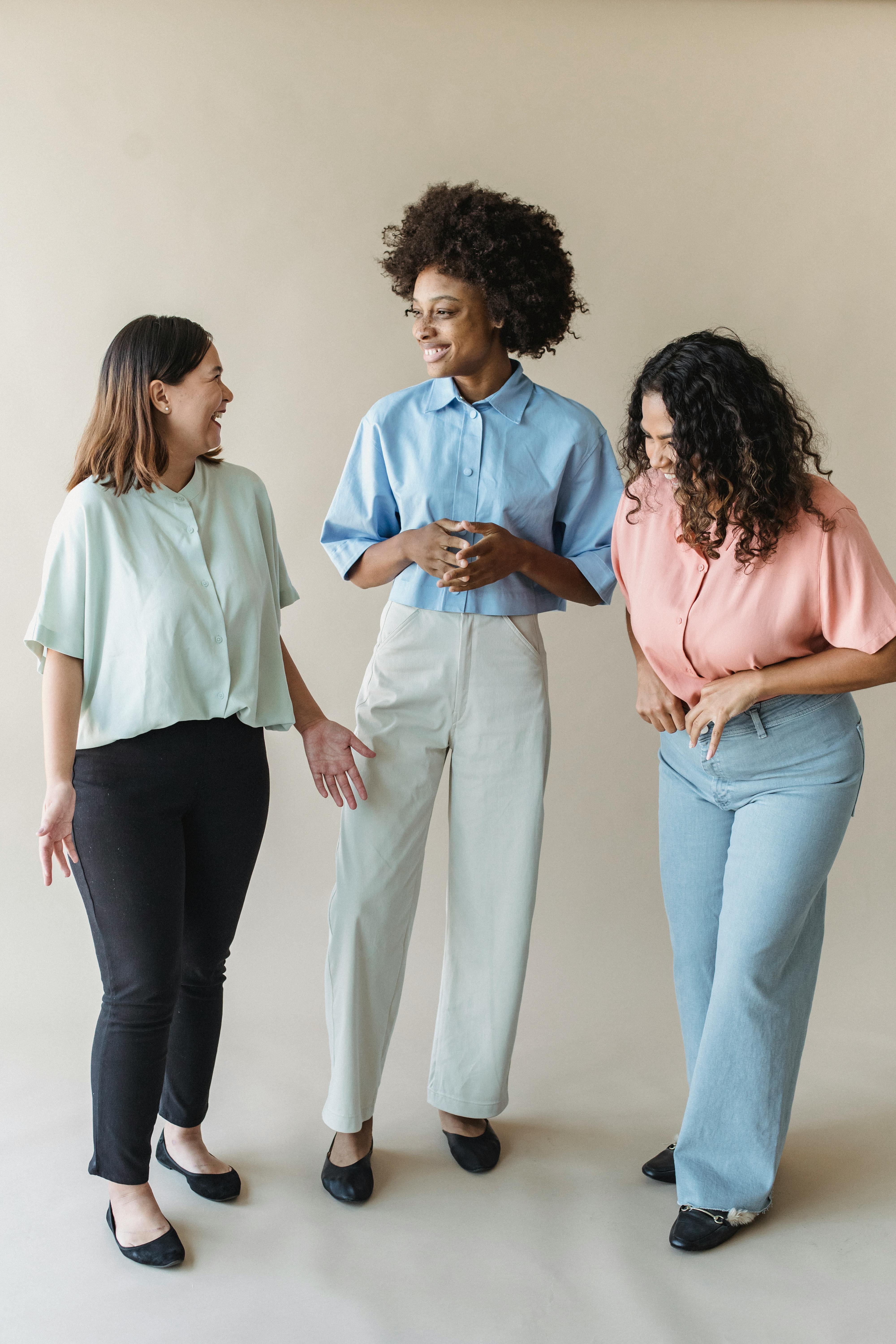 Three Young Women Talking and Smiling · Free Stock Photo