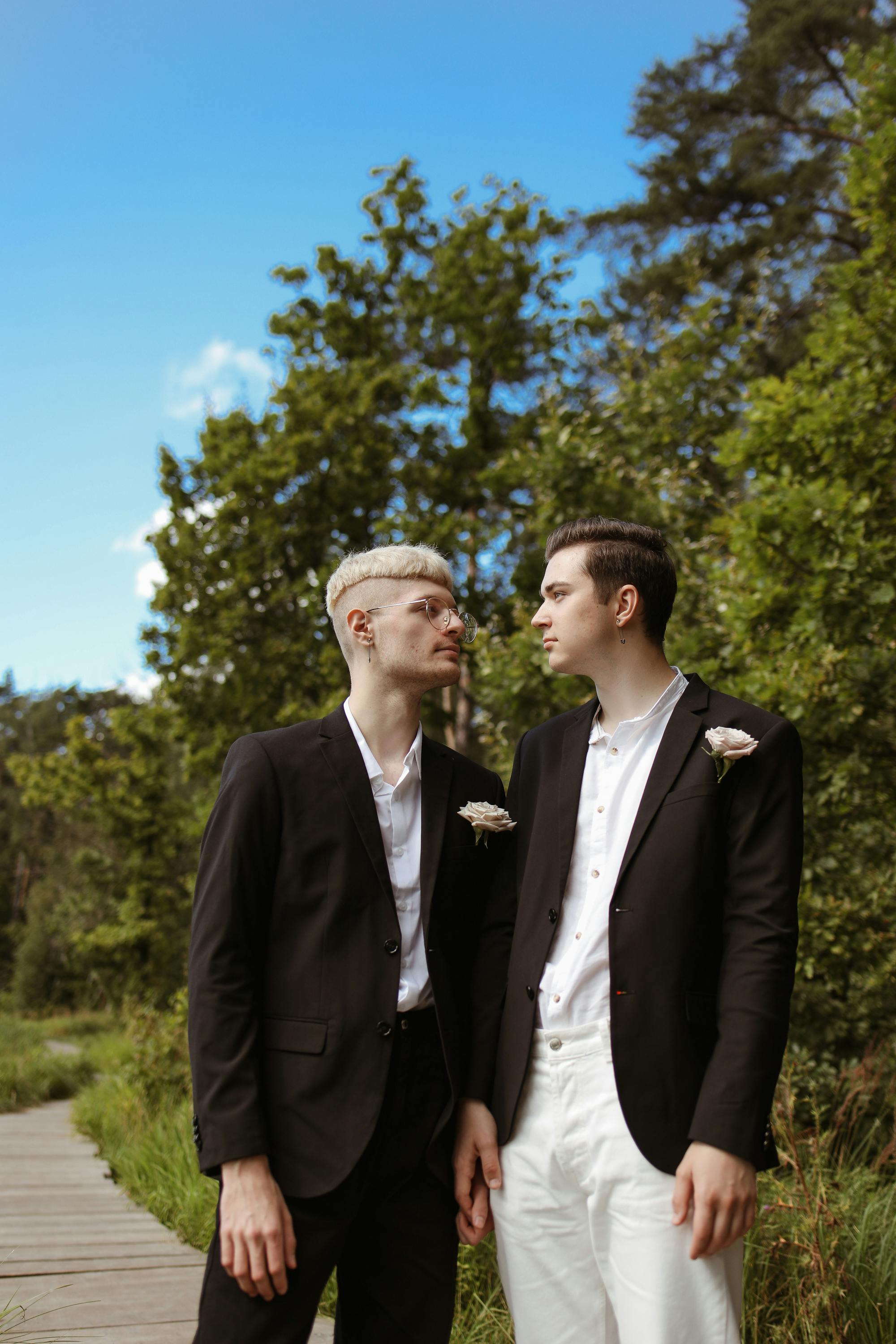 Men in Elegant Suits Standing on Path in Park · Free Stock Photo