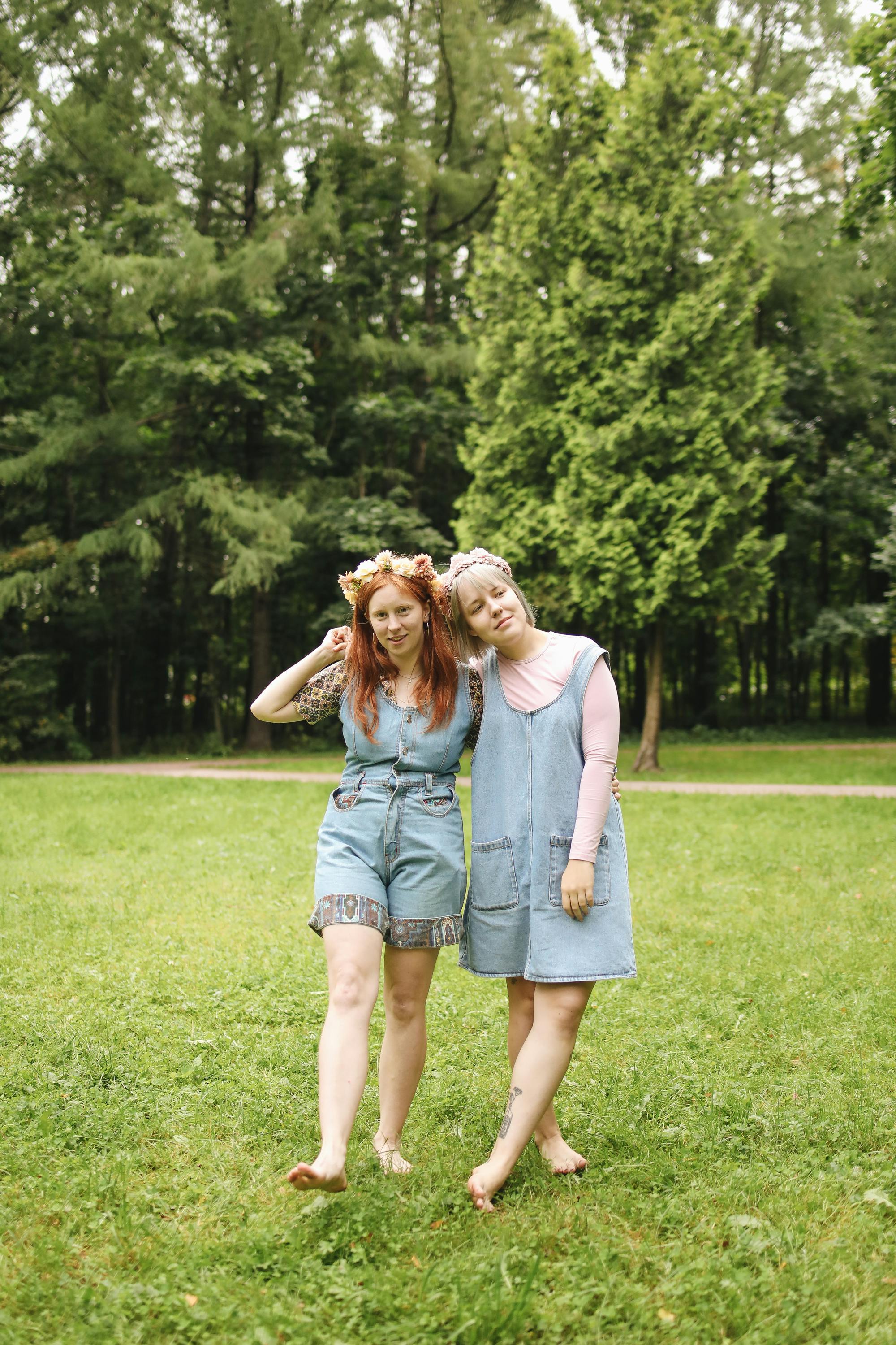 Friends Standing Barefoot on Grass · Free Stock Photo