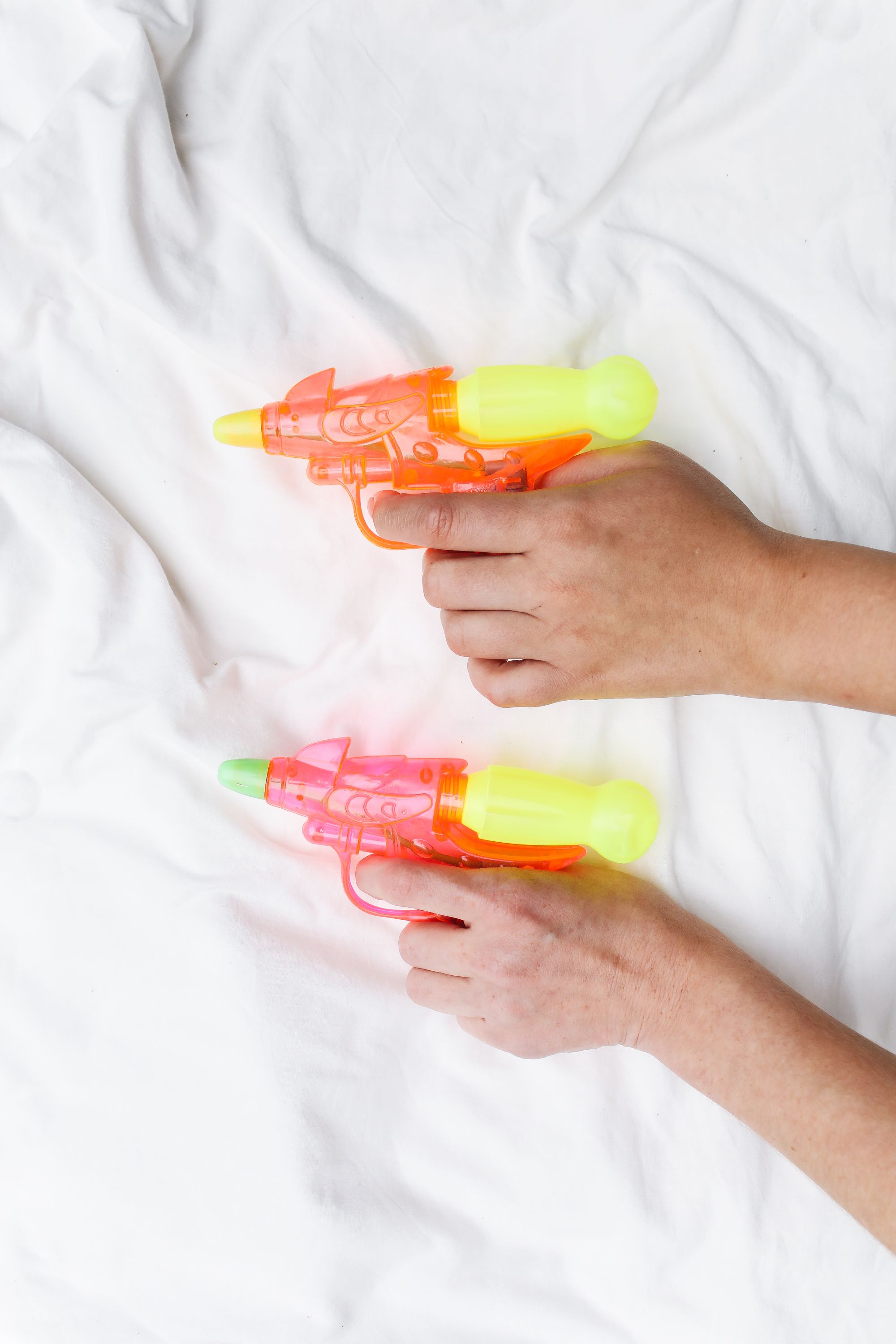 Hands Holding Water Guns · Free Stock Photo