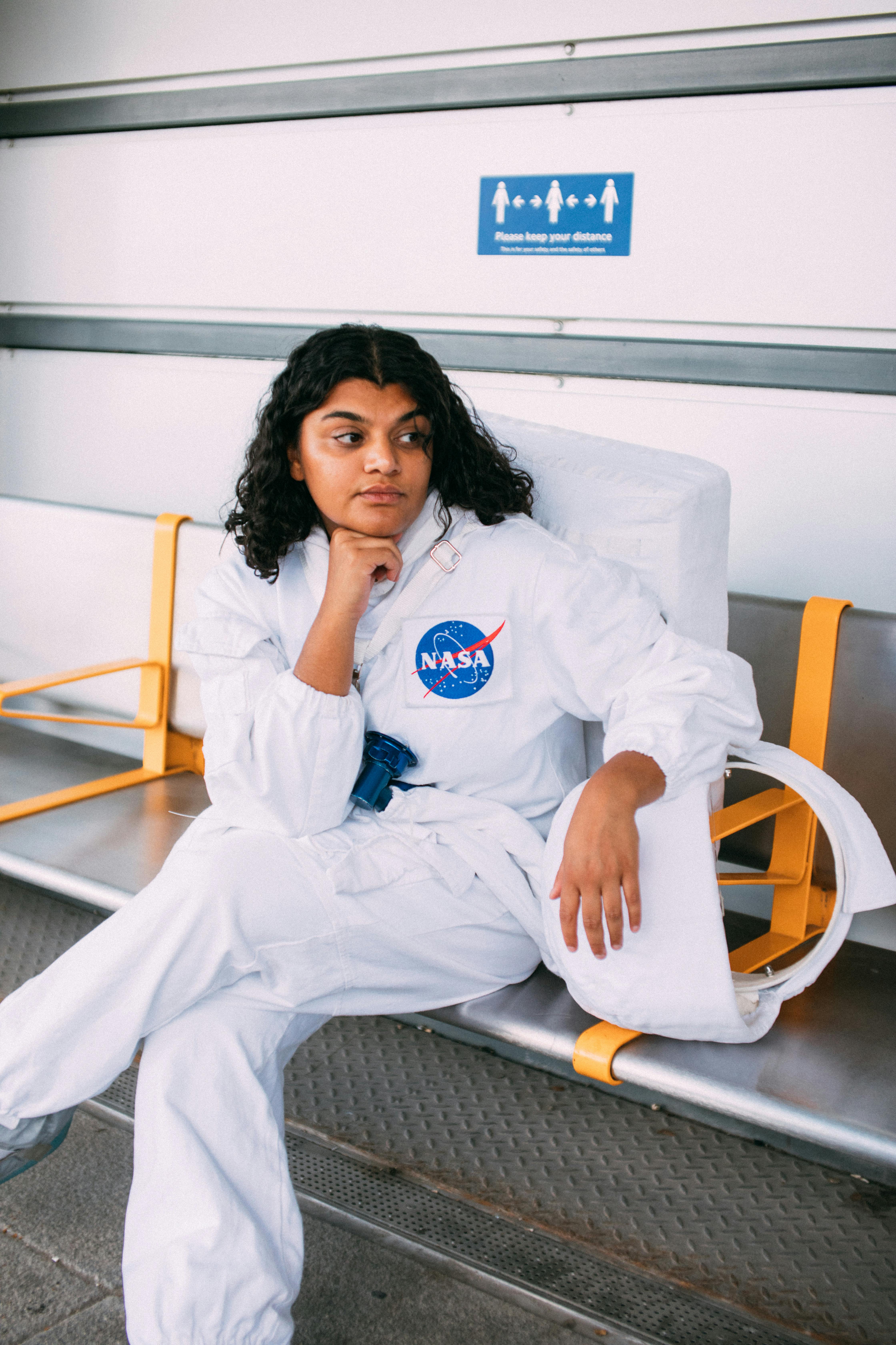 Woman In A Costume Sitting On A Bench · Free Stock Photo