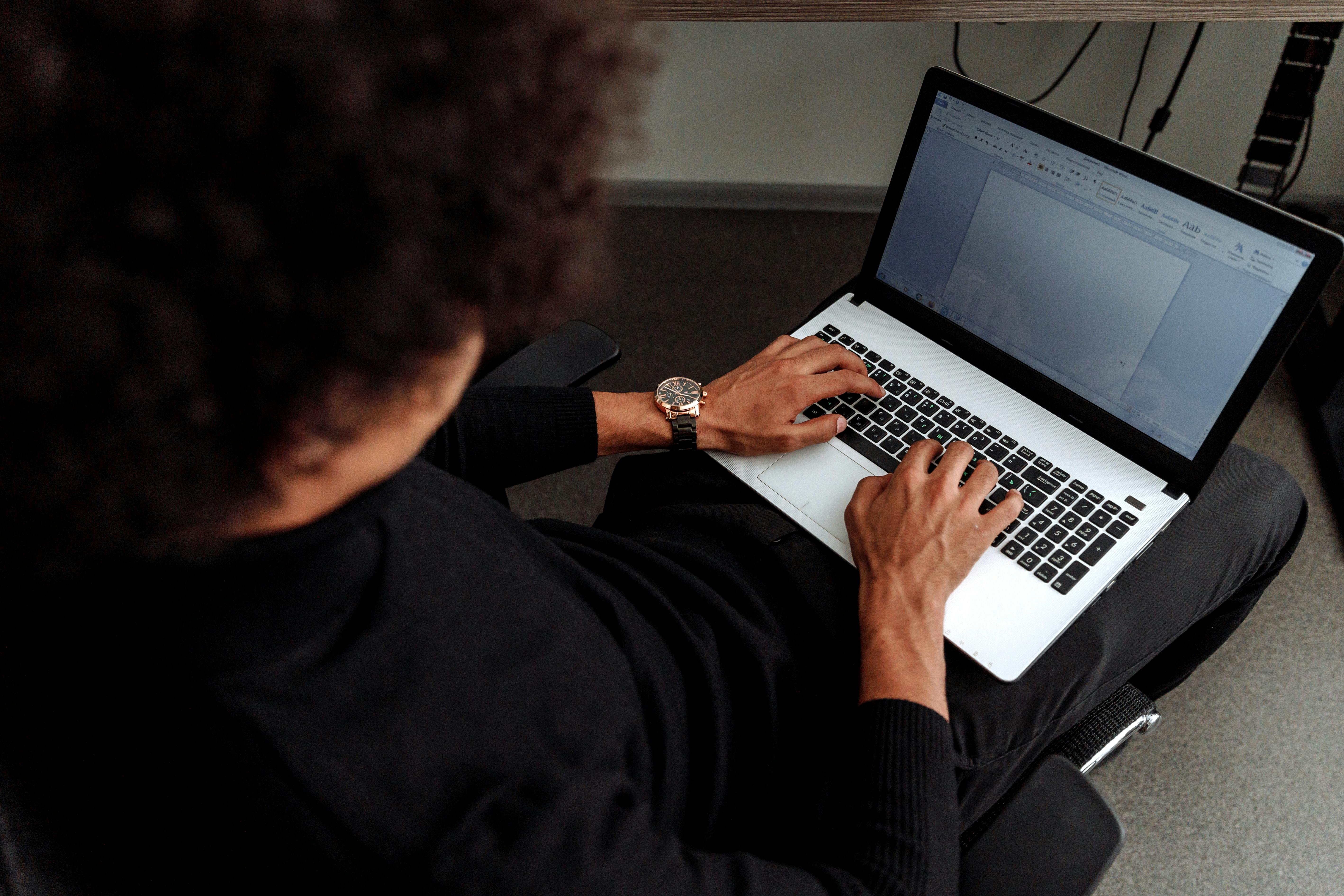 A Person Typing on a Laptop · Free Stock Photo