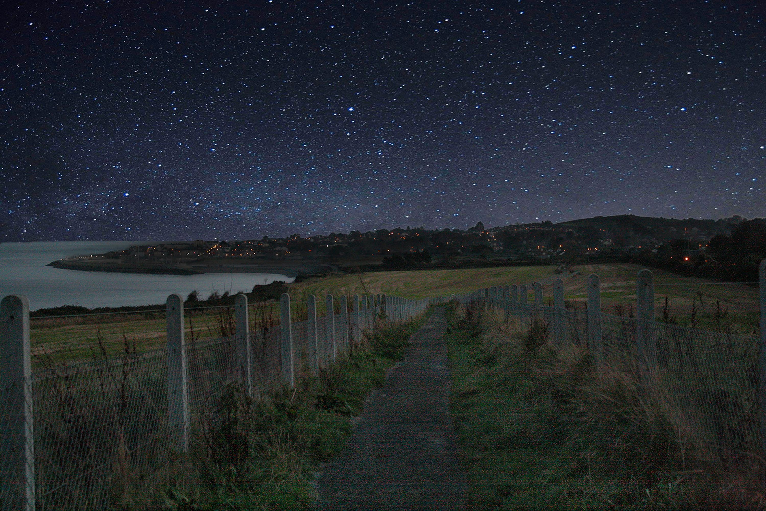 Path, Lake and Town Under Night Sky · Free Stock Photo