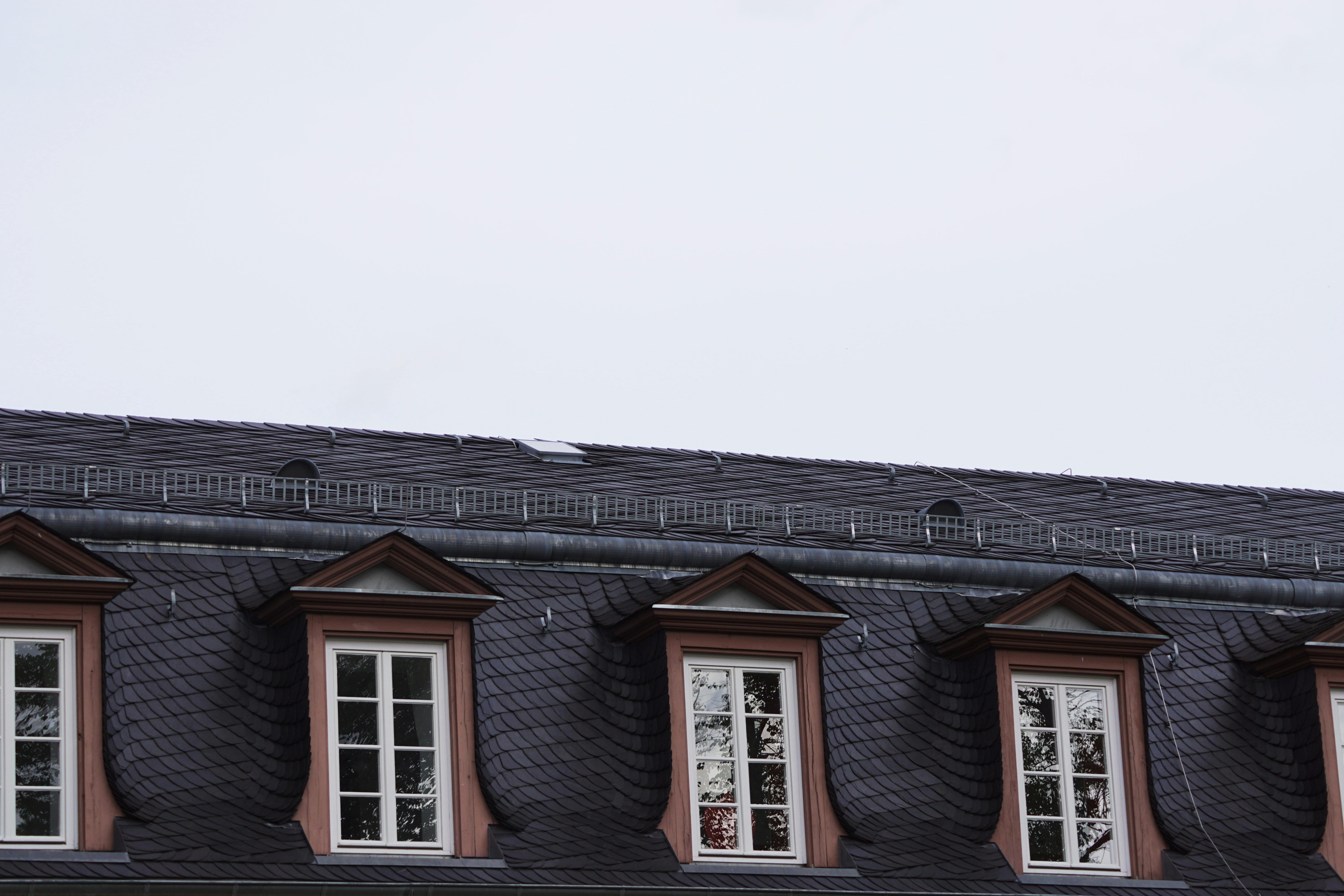 Close-up of a Windows in the Roof of a Tenement House · Free Stock Photo