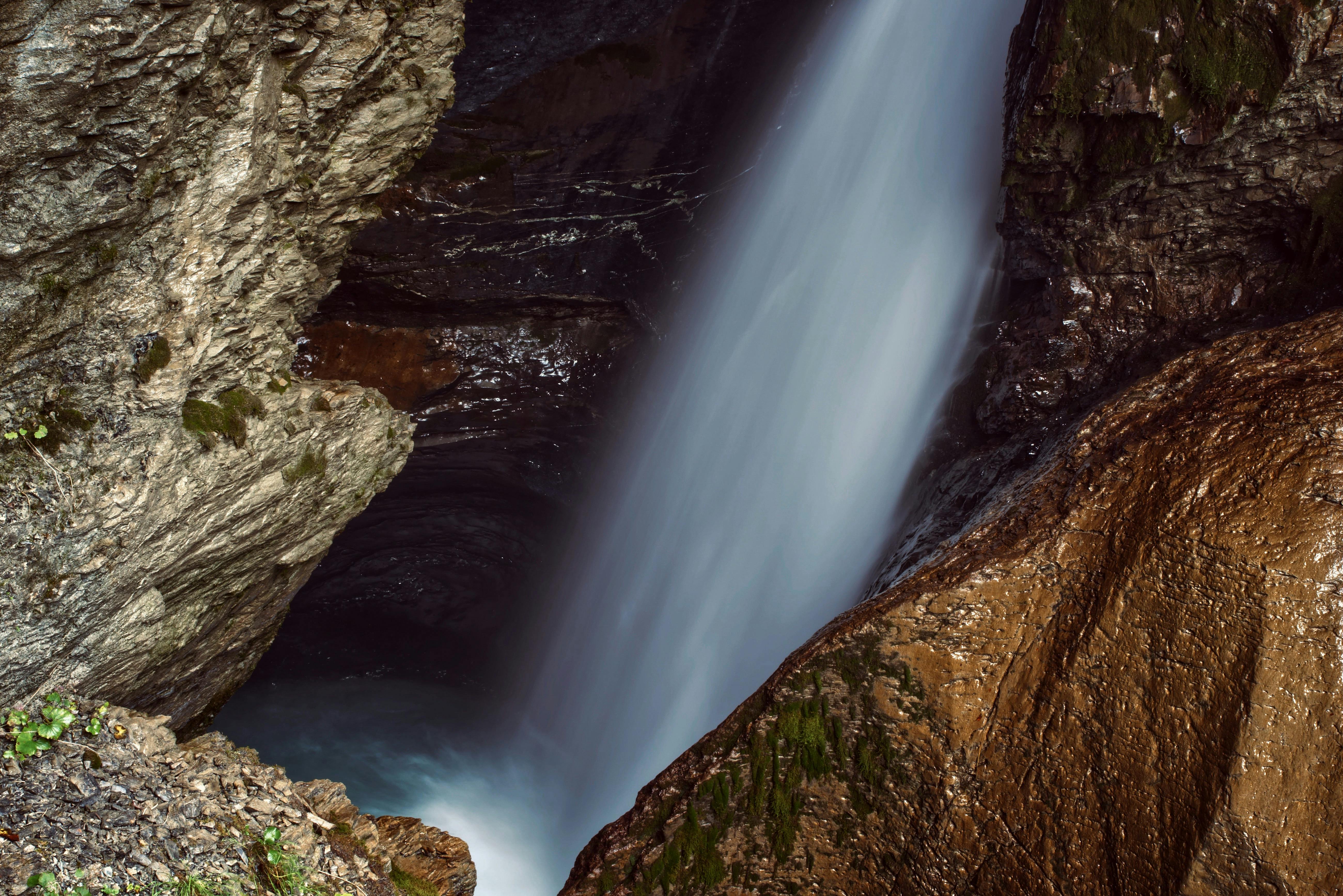Rapid waterfall streaming in ravine · Free Stock Photo