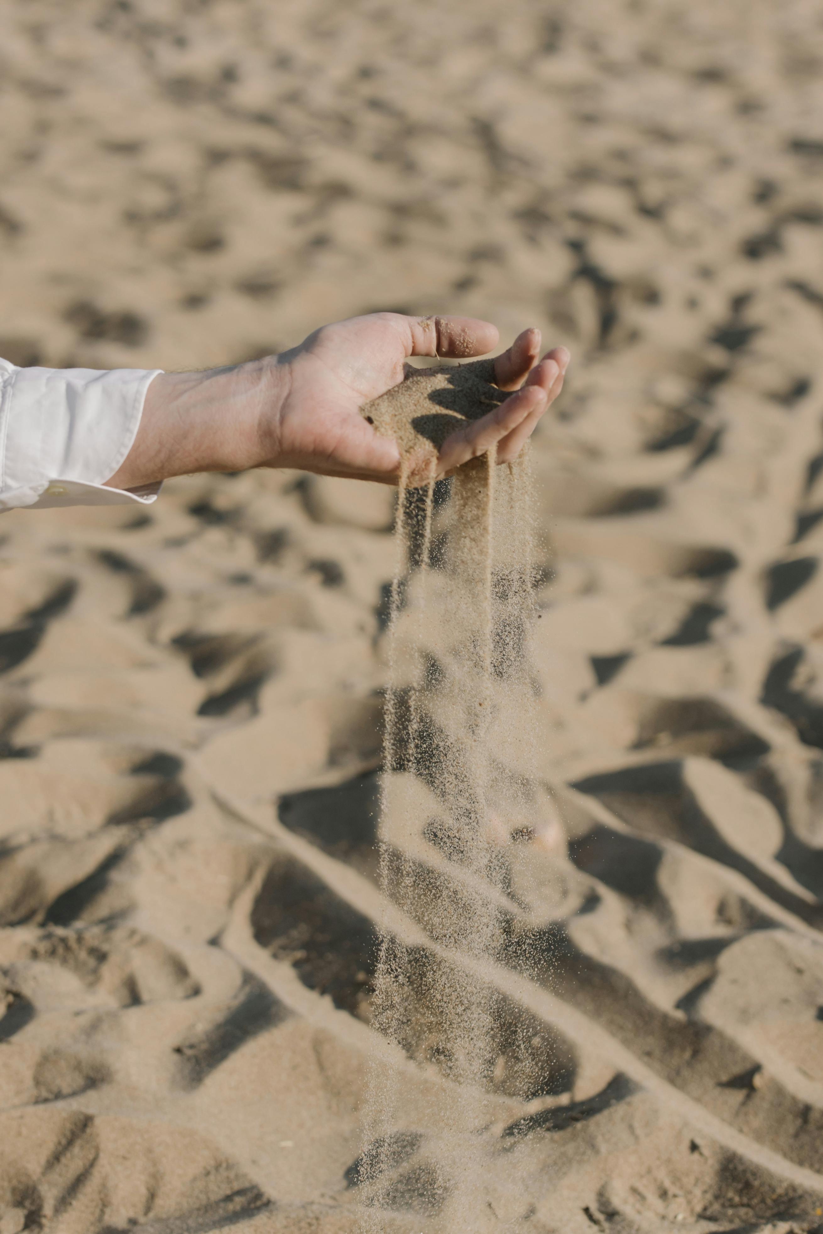 Person Holding Sand · Free Stock Photo