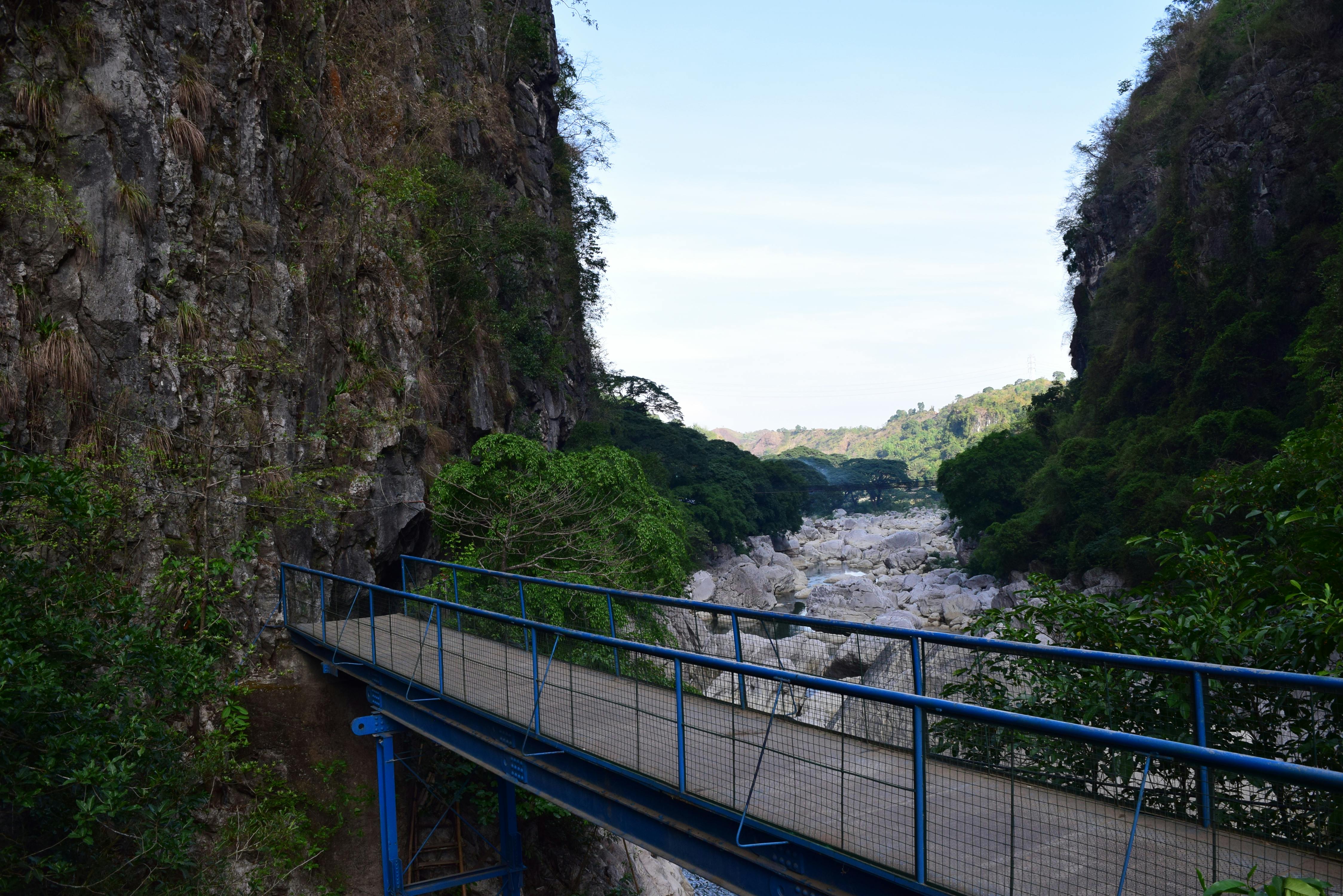 Anonymous tourist enjoying waterfall streaming in rocky ravine · Free ...