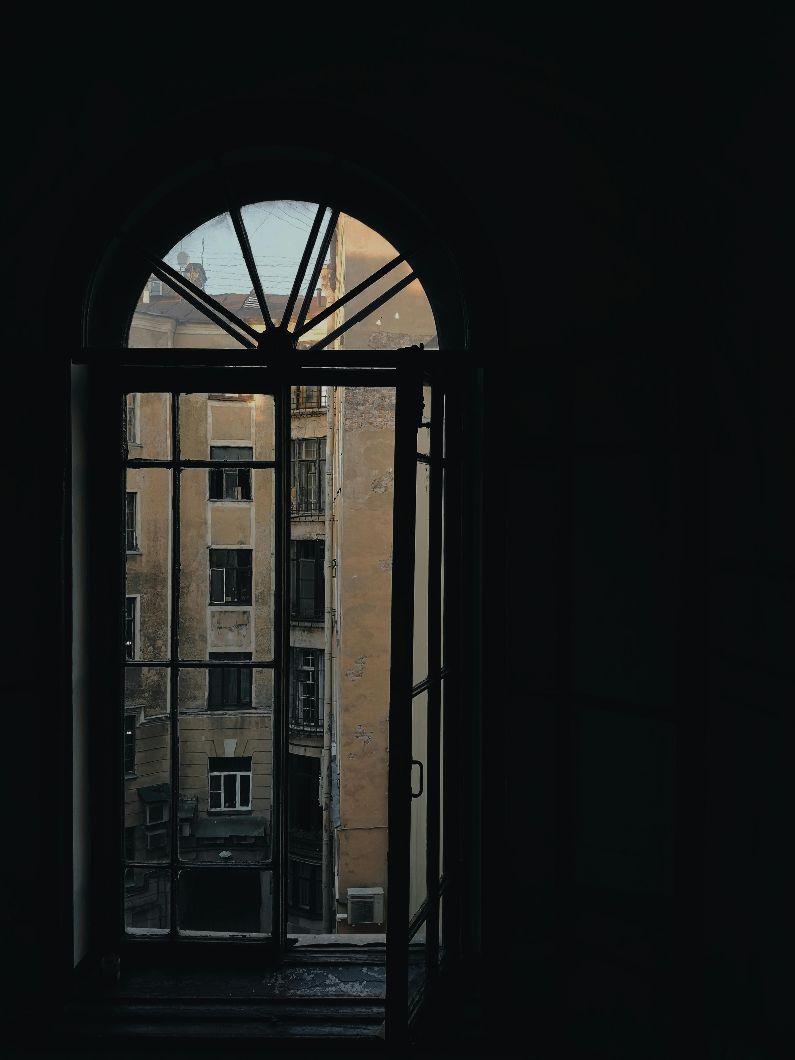 A View of Concrete Buildings from a Window · Free Stock Photo