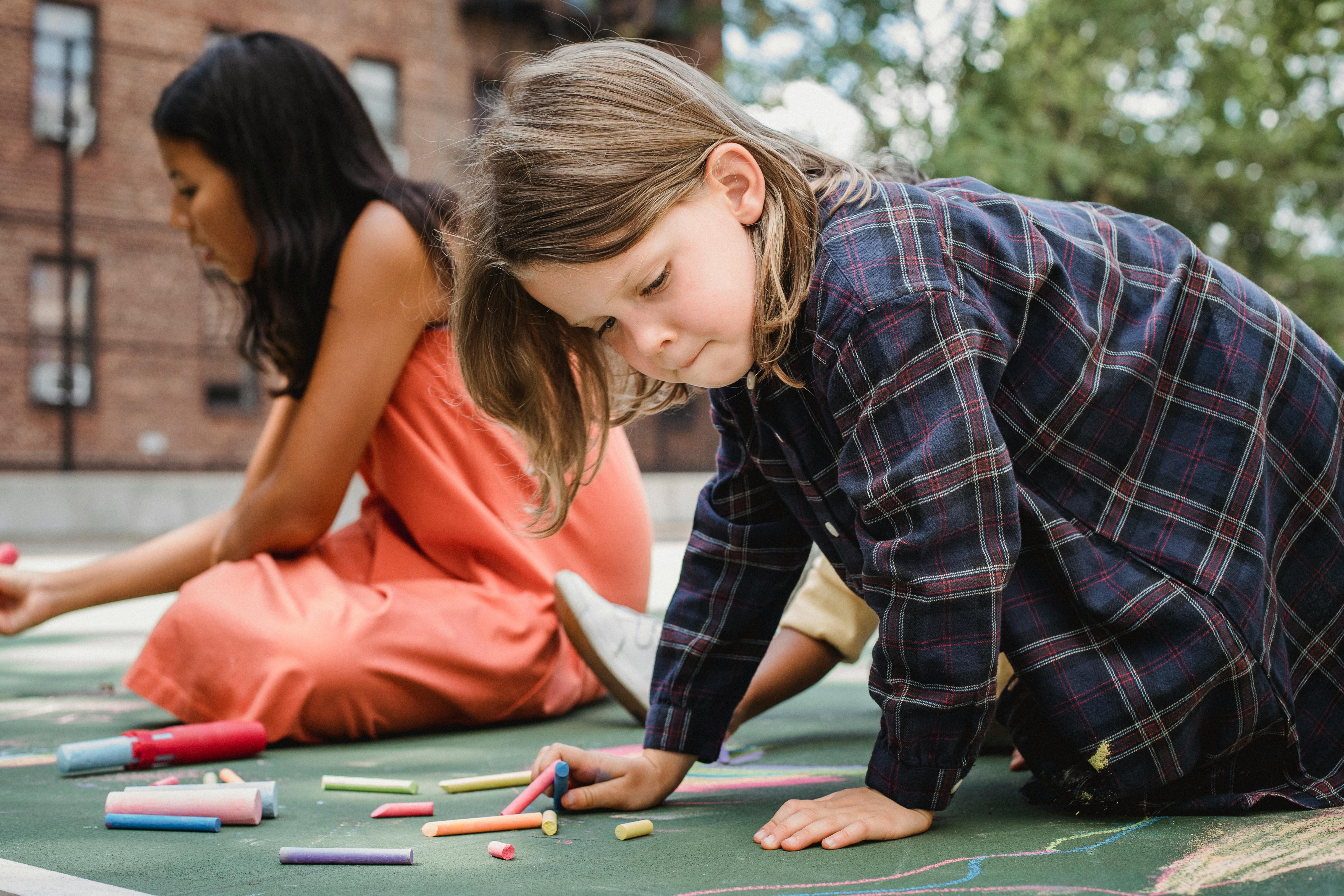 Children Drawing on Pavement in Schoolyard · Free Stock Photo