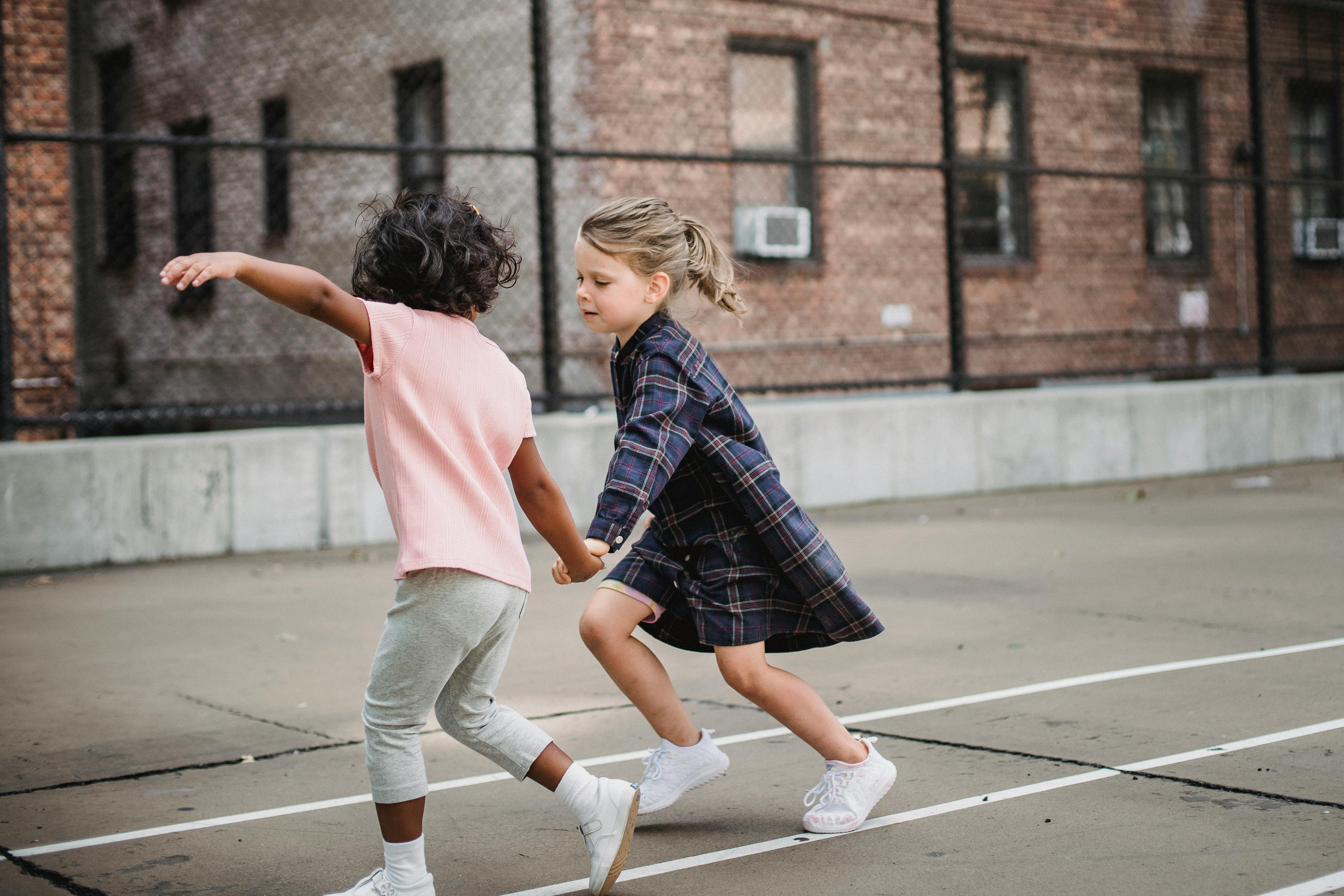 Kids Playing while Holding Hands · Free Stock Photo