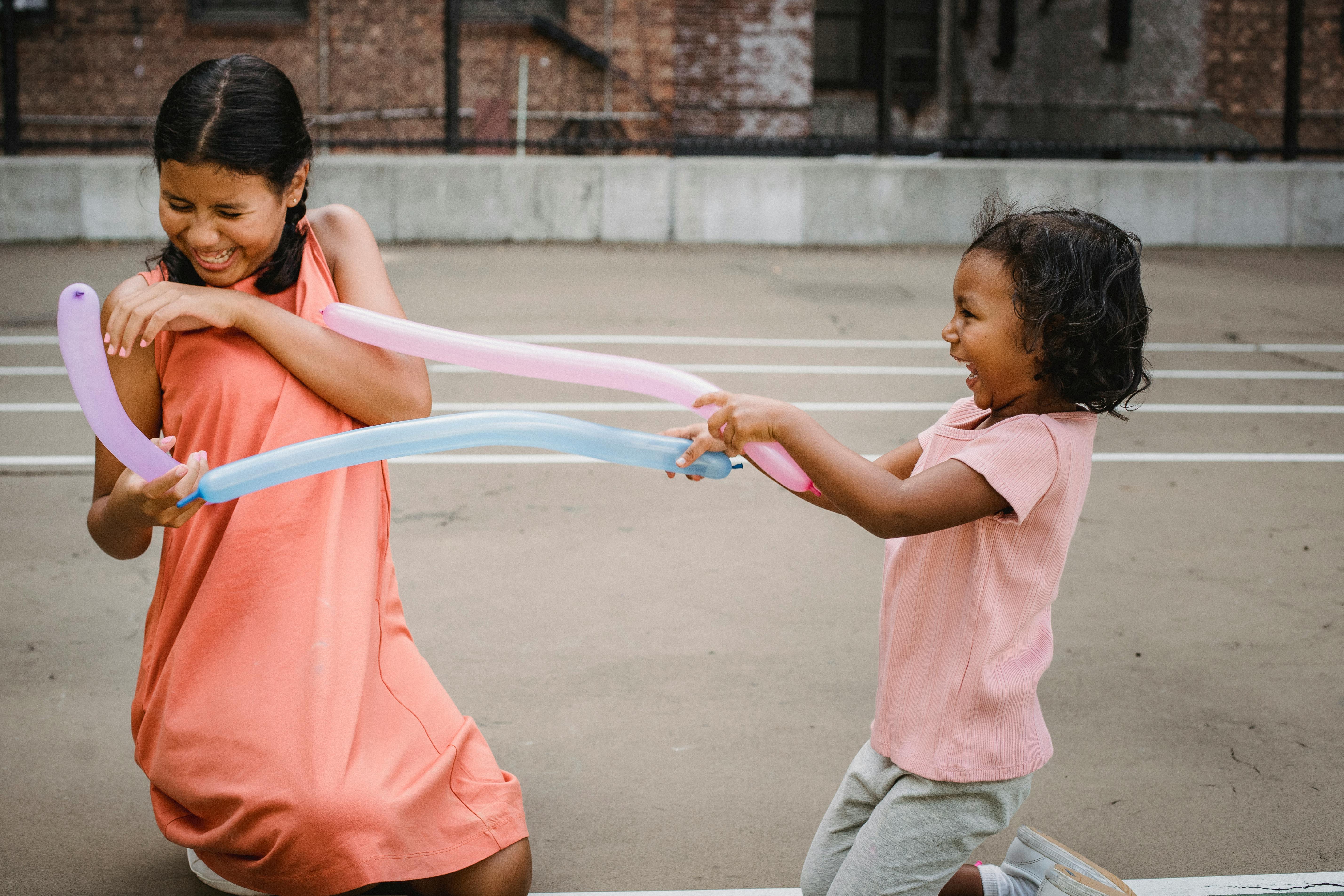 Girls Playing with Balloons · Free Stock Photo