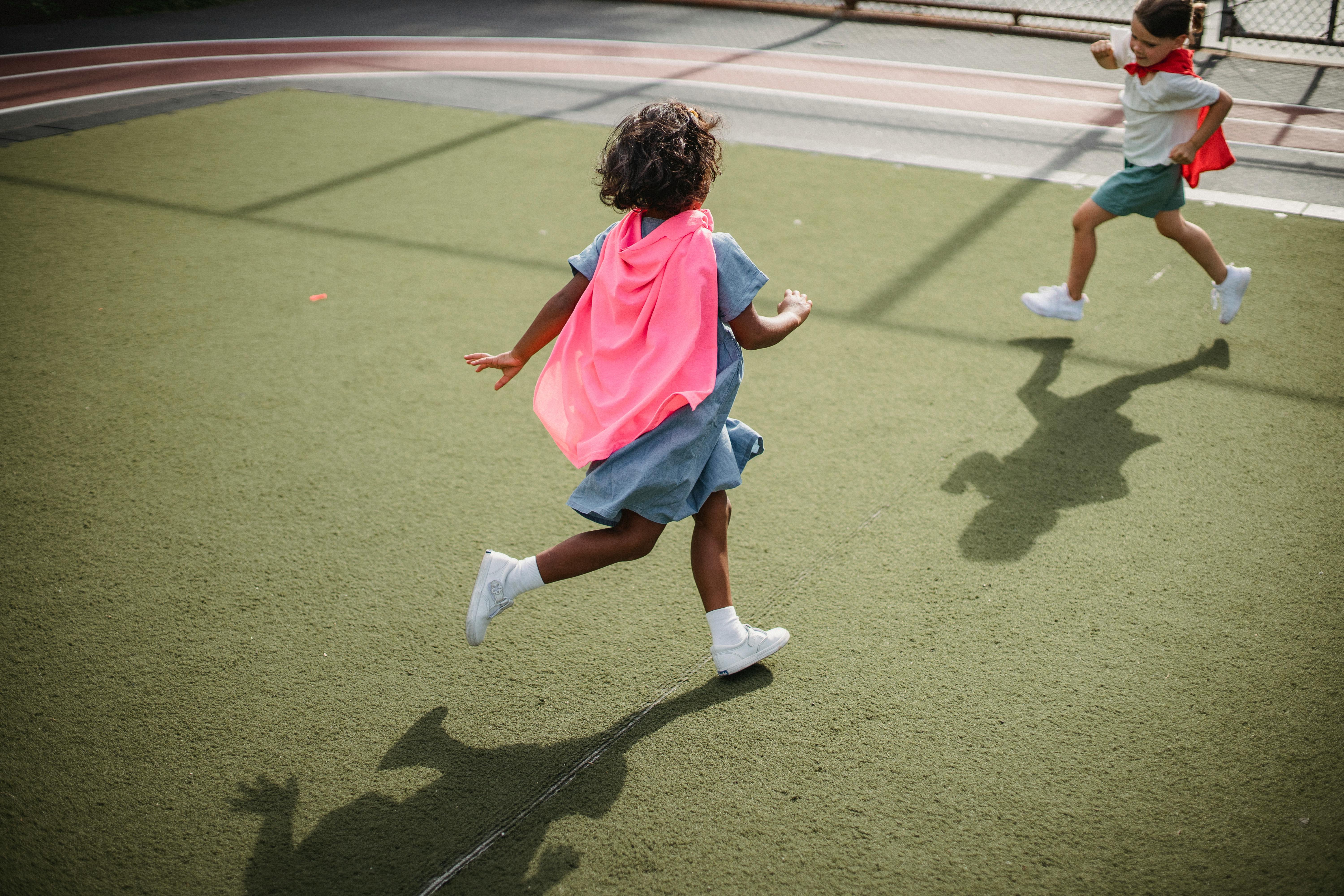 Girls Running on the Playground · Free Stock Photo