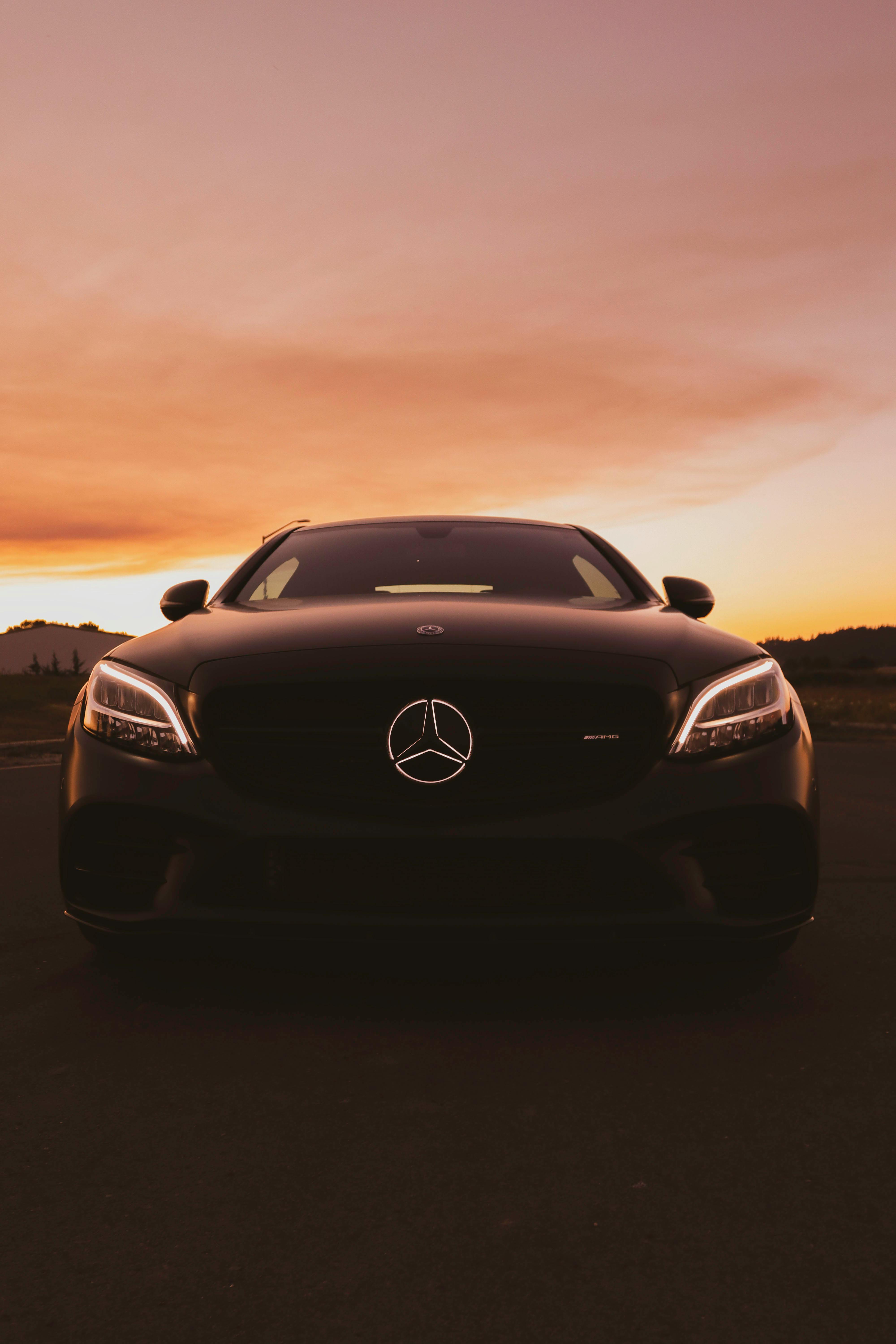 A Luxury Car and a Scenic Sunset · Free Stock Photo