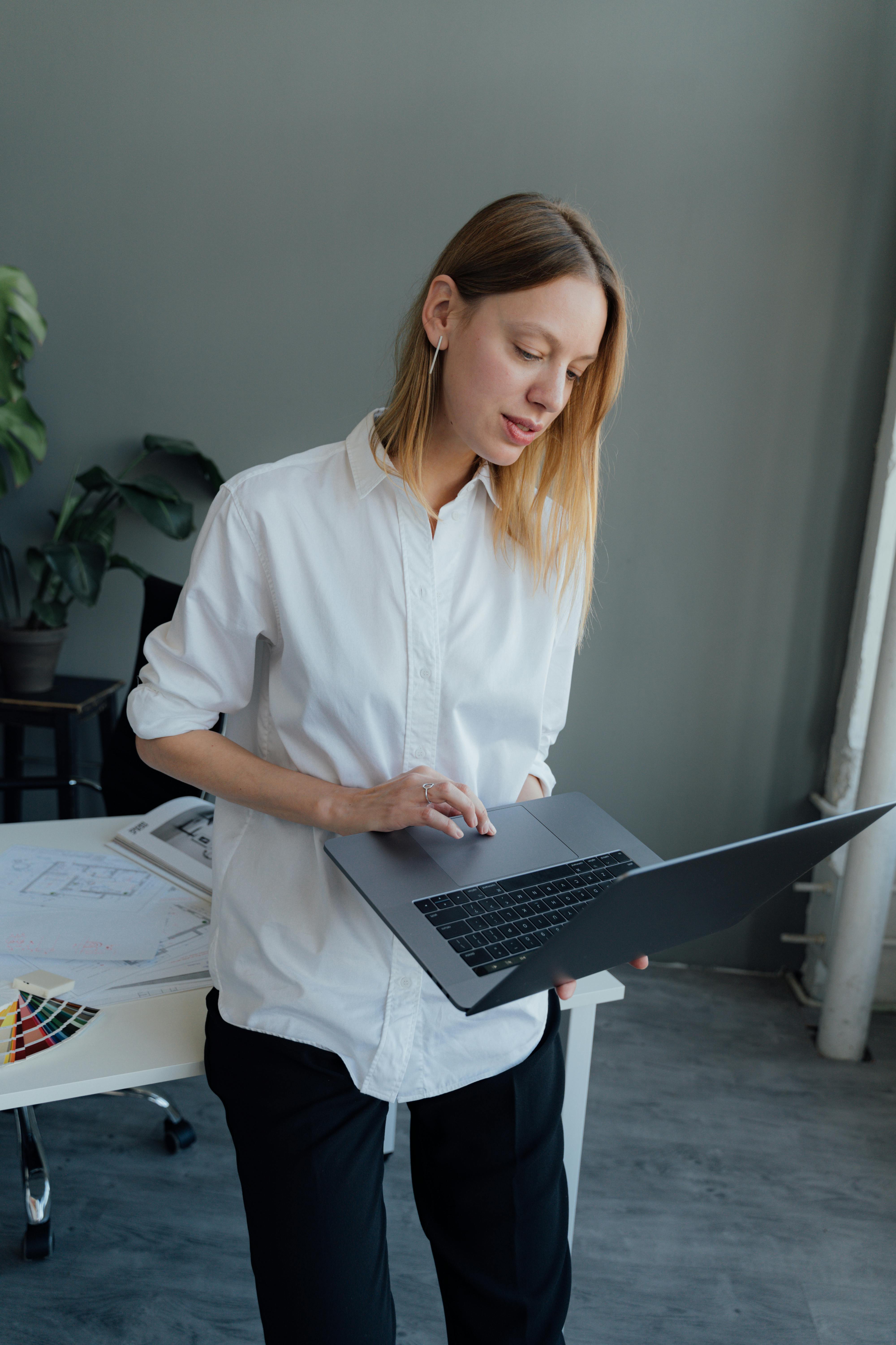 Female Professional using Laptop · Free Stock Photo