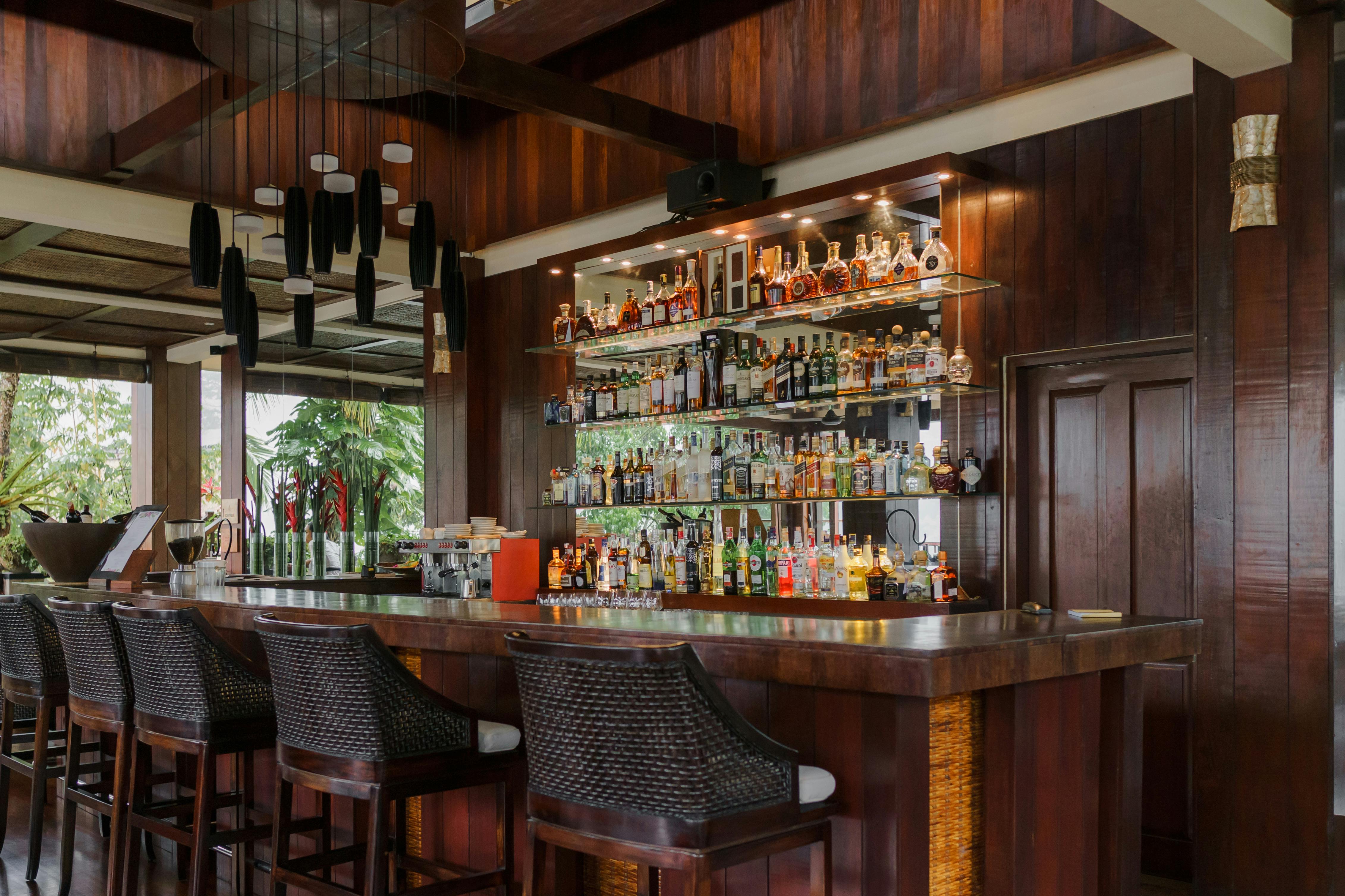 Brown Wooden Bar Counter With High Chairs · Free Stock Photo