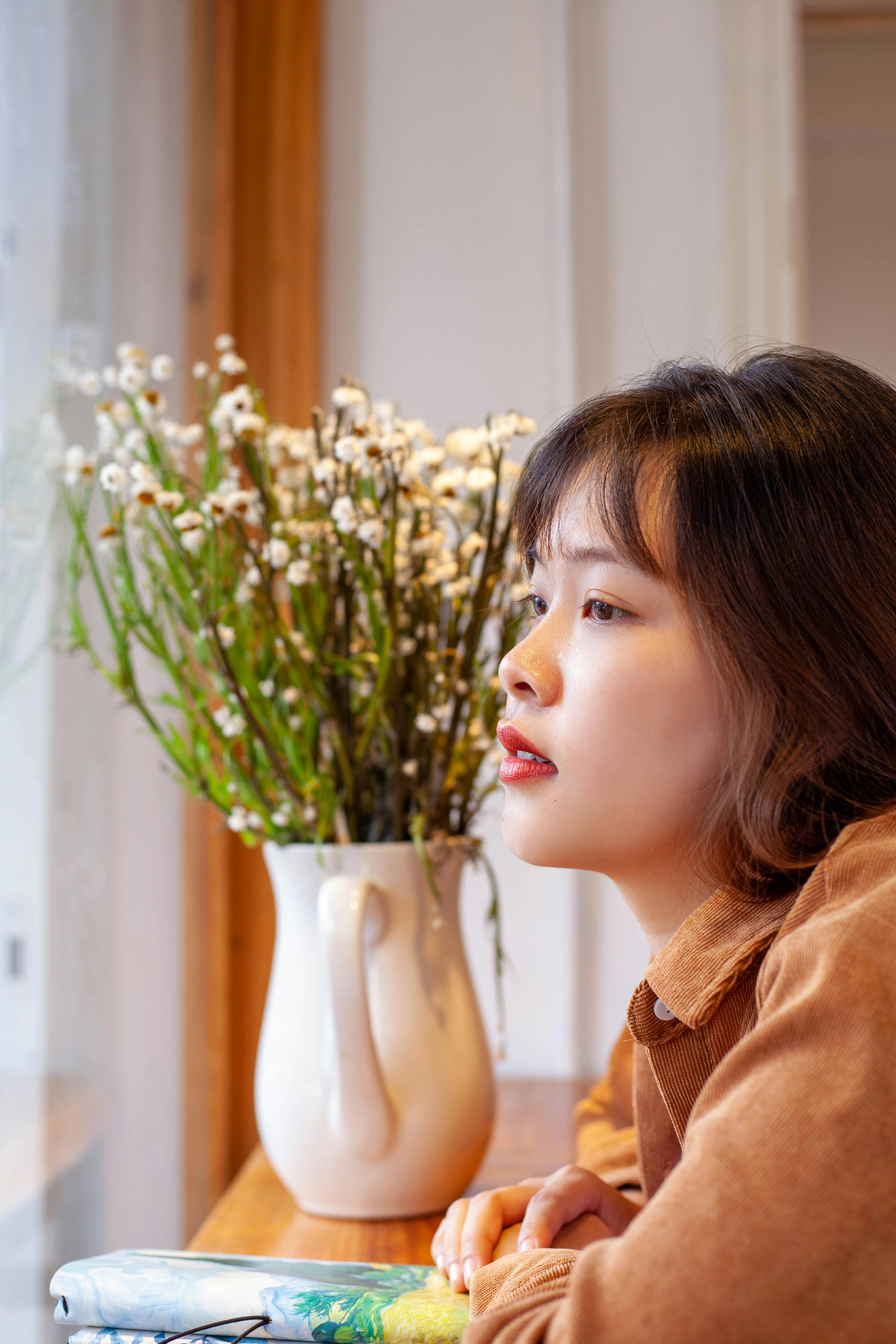 A Woman Passing Through Window Blinds · Free Stock Photo