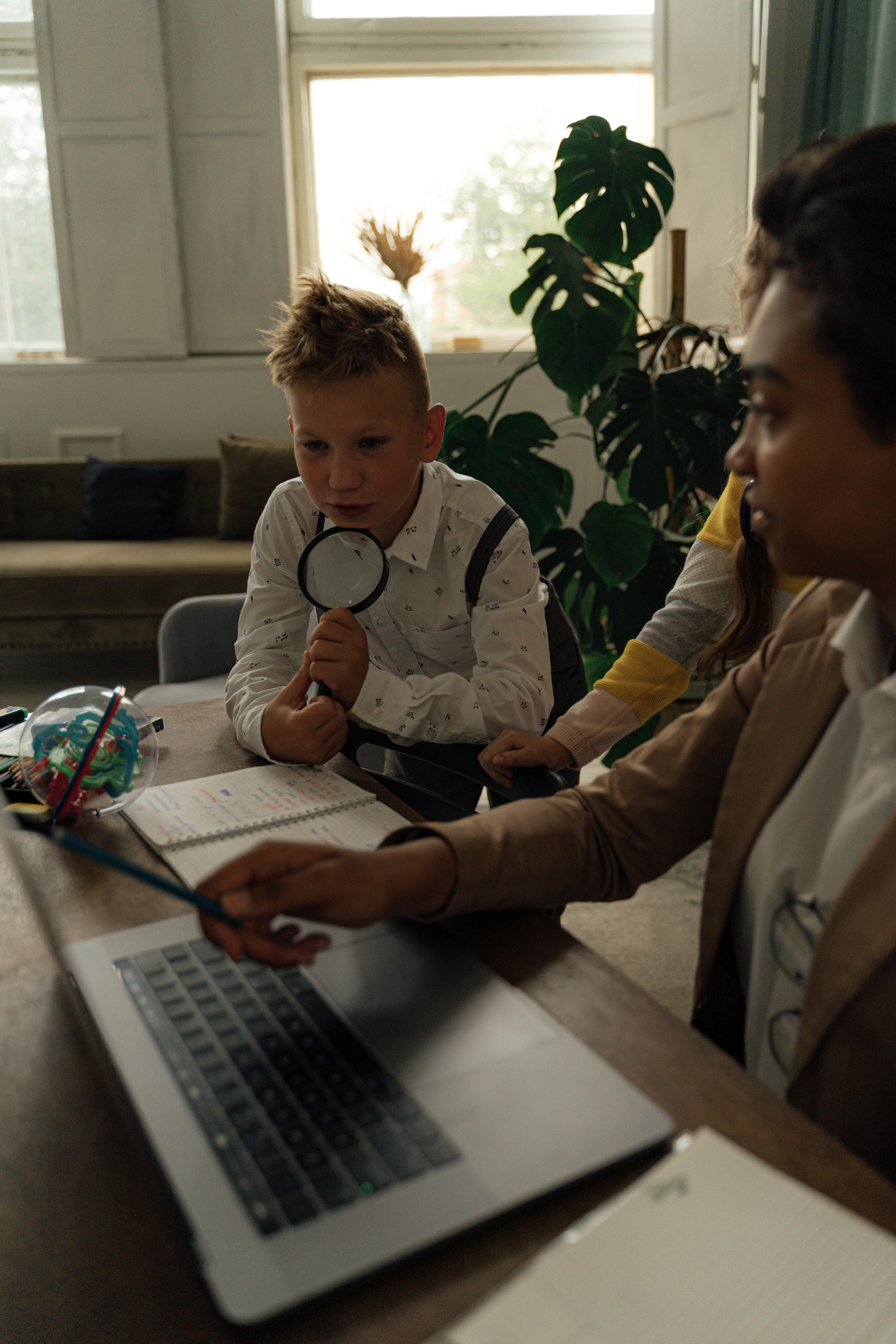 A Boy Writing His Answers on the Blackboard · Free Stock Photo