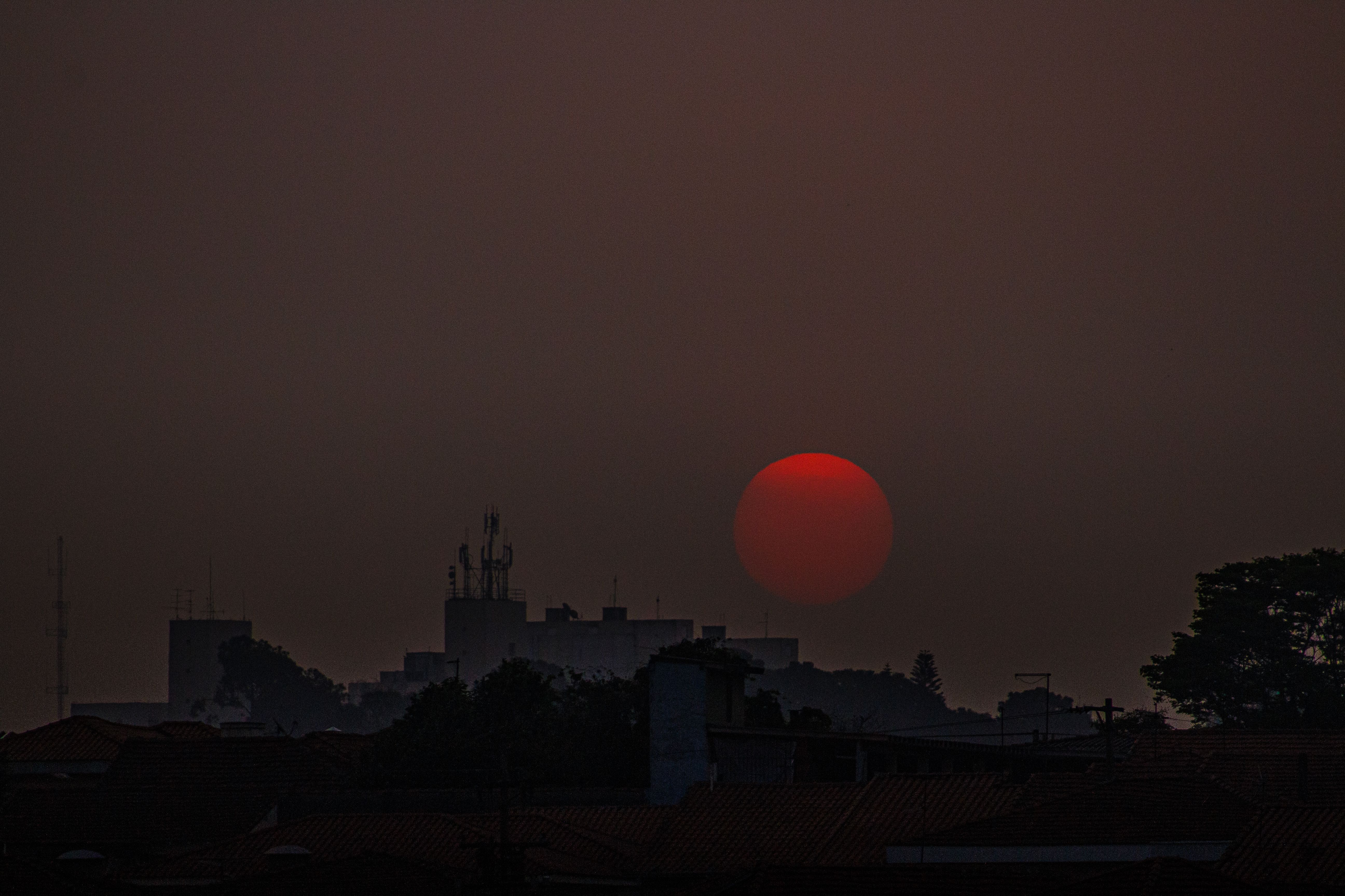 Calm sunset sky over city roofs · Free Stock Photo