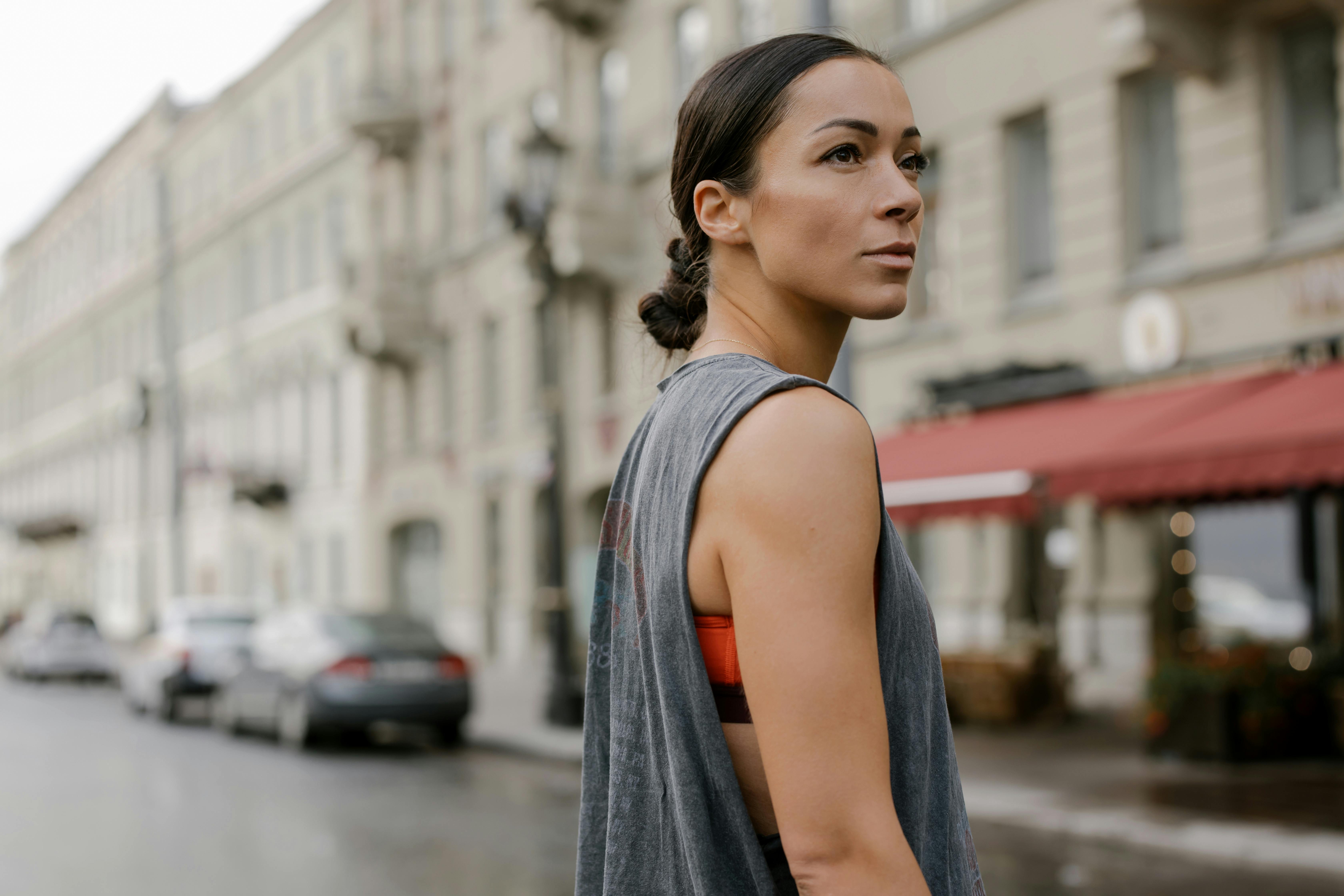 A Woman in a Tank Top Jumping · Free Stock Photo