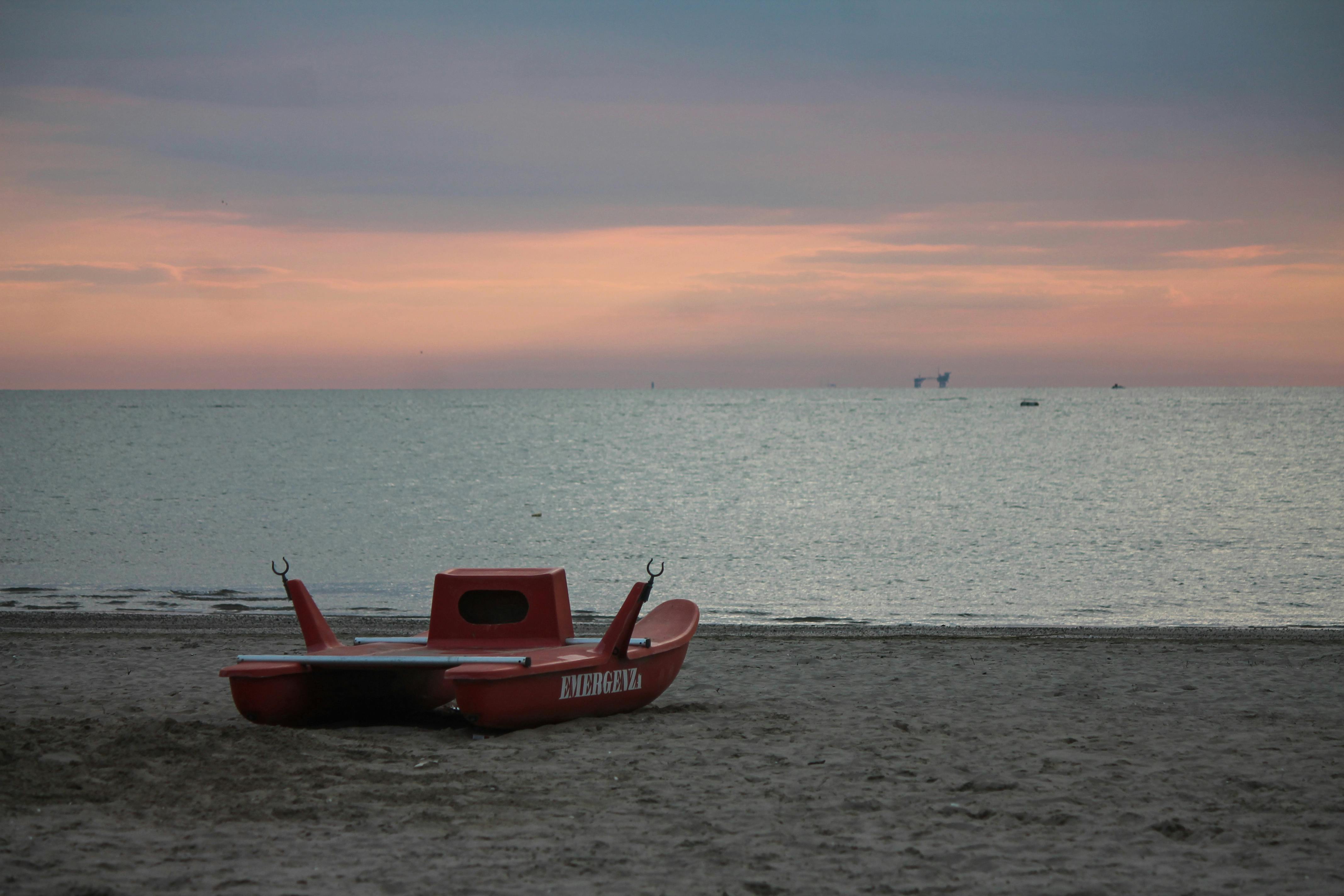 White and Brown Speedboat on White Sand Beside Ocean during Daytime ...