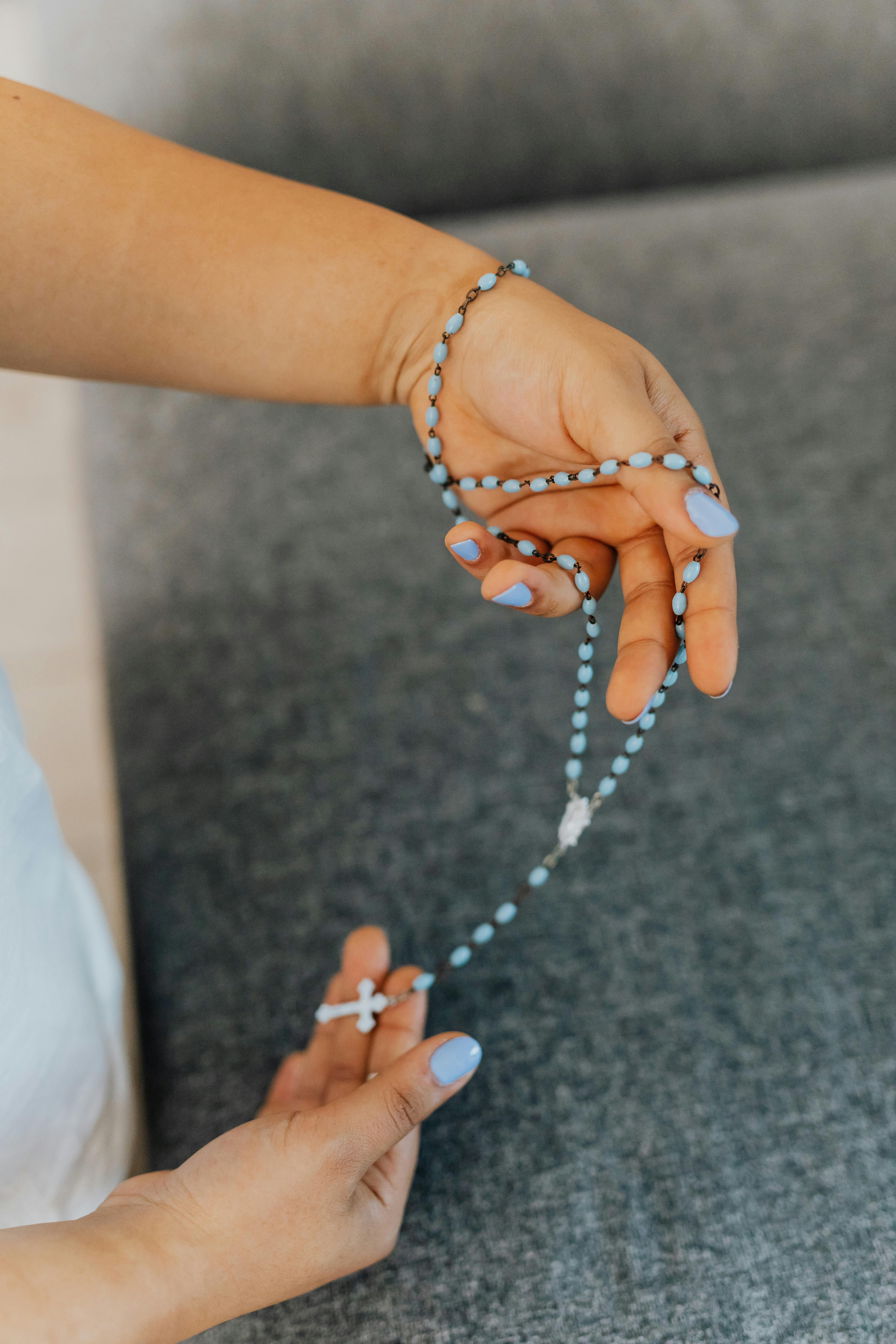 A Person Holding a Rosary · Free Stock Photo