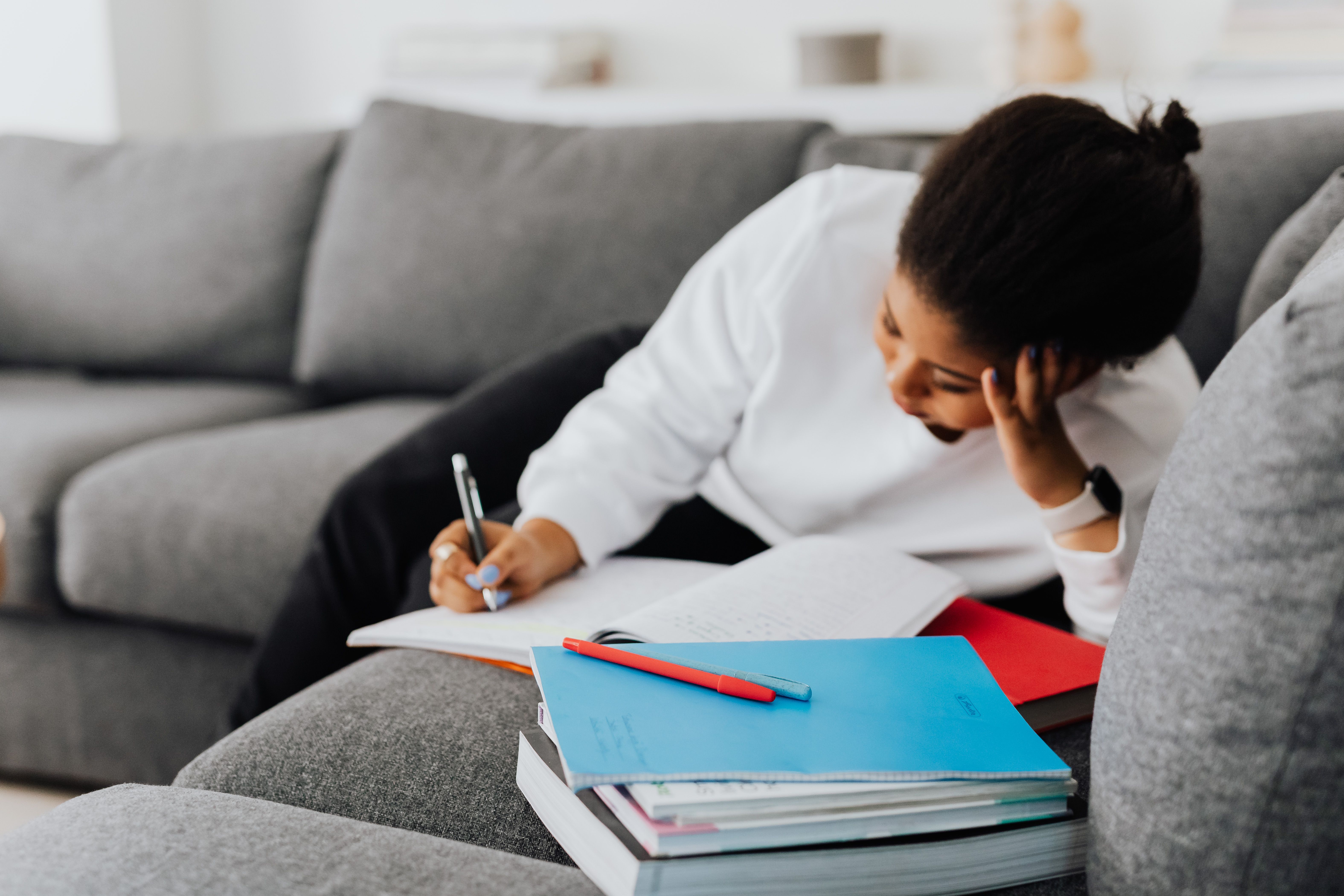 A Woman Doing Her Homework · Free Stock Photo