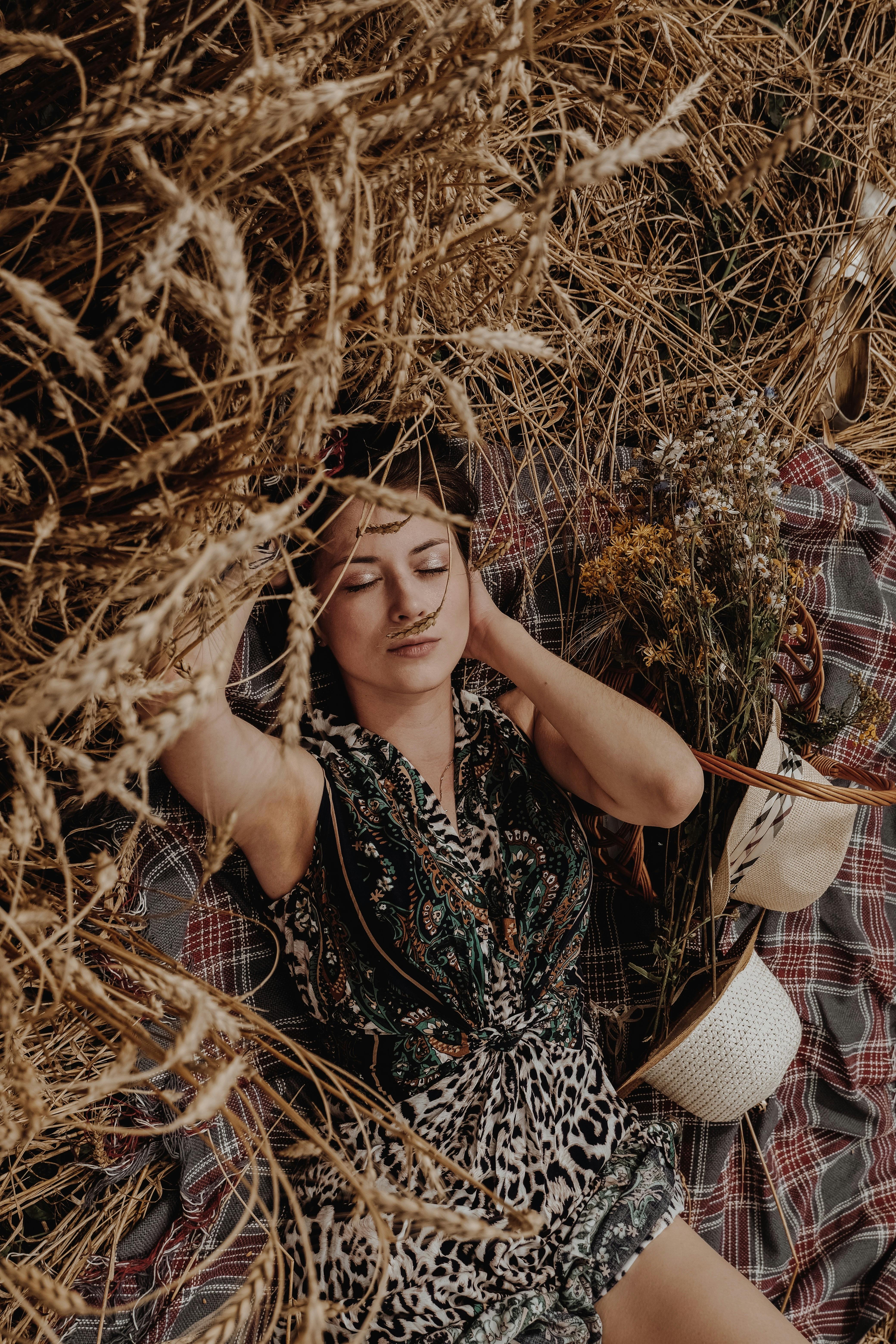 Young woman lying in field in countryside · Free Stock Photo