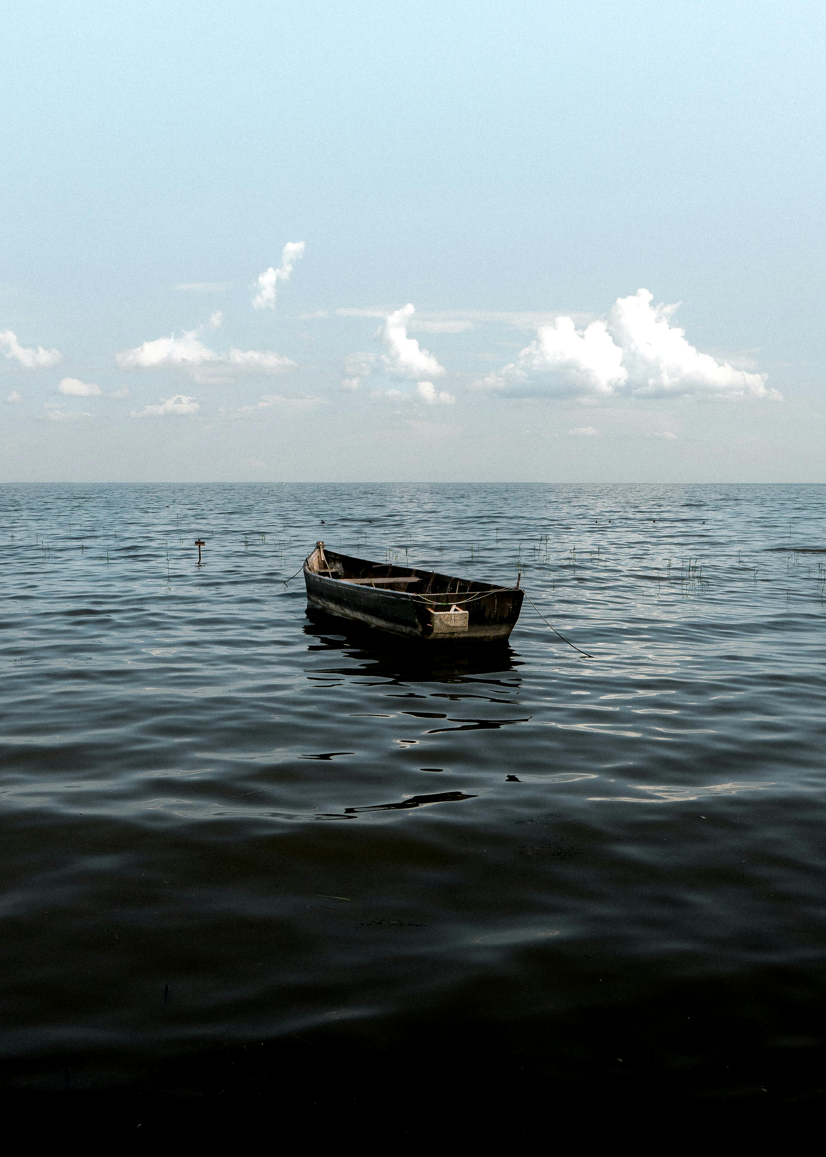 Wooden Boat on Body of Water · Free Stock Photo
