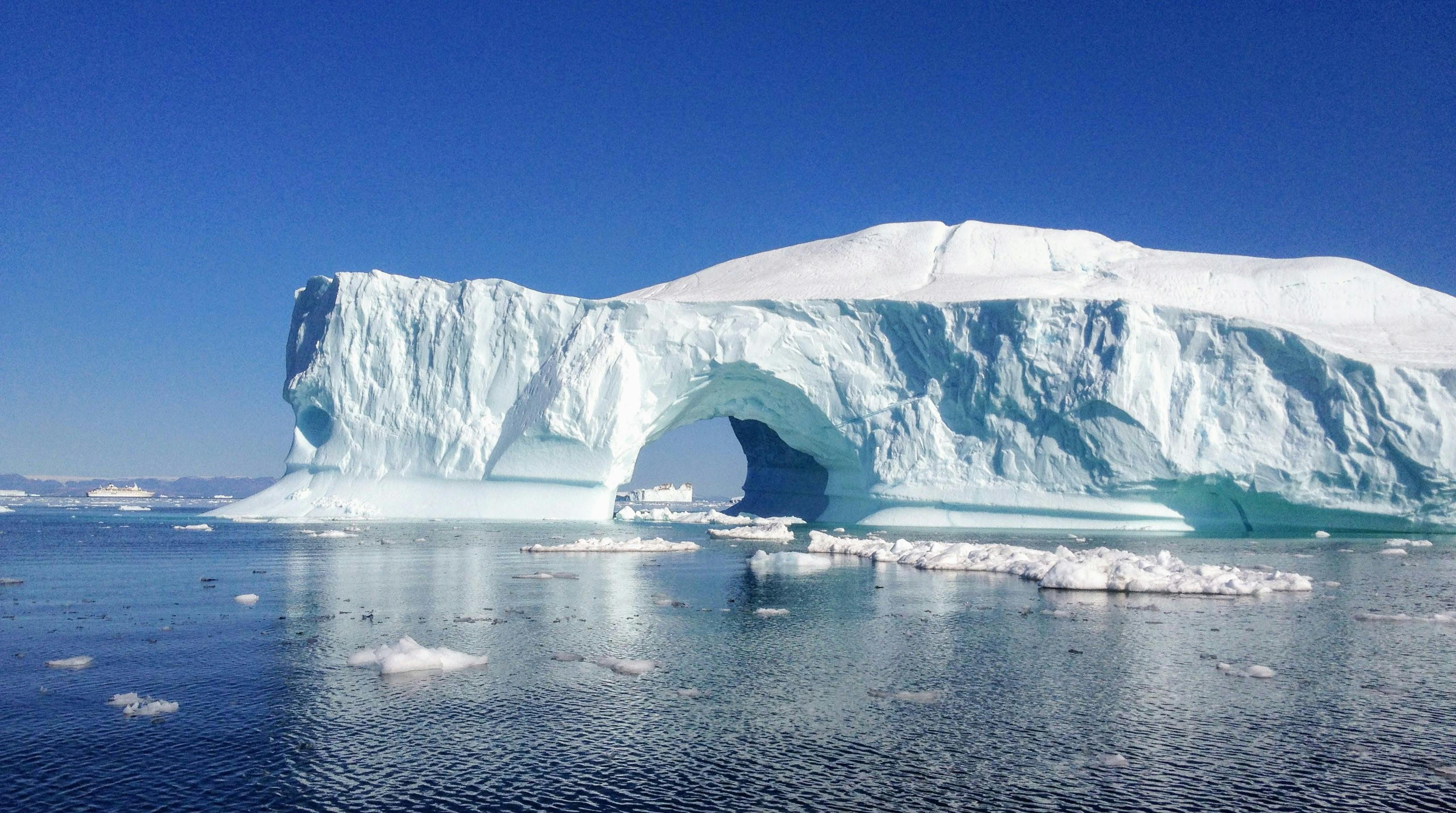 A Glacier with an Ice Arch · Free Stock Photo