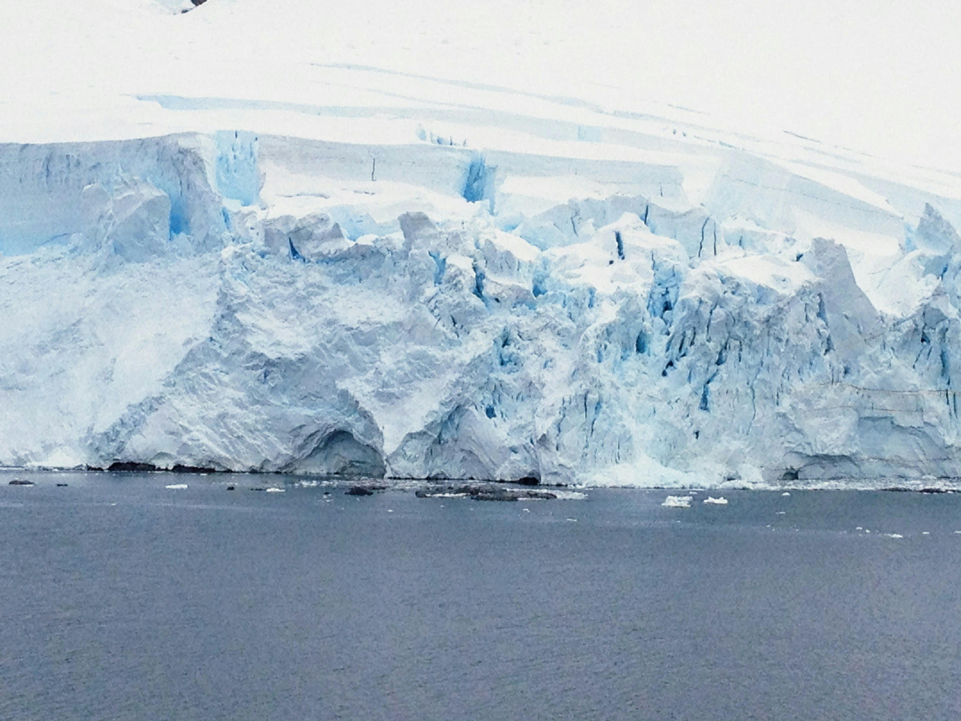 A Massive Glacier near a Body of Water · Free Stock Photo