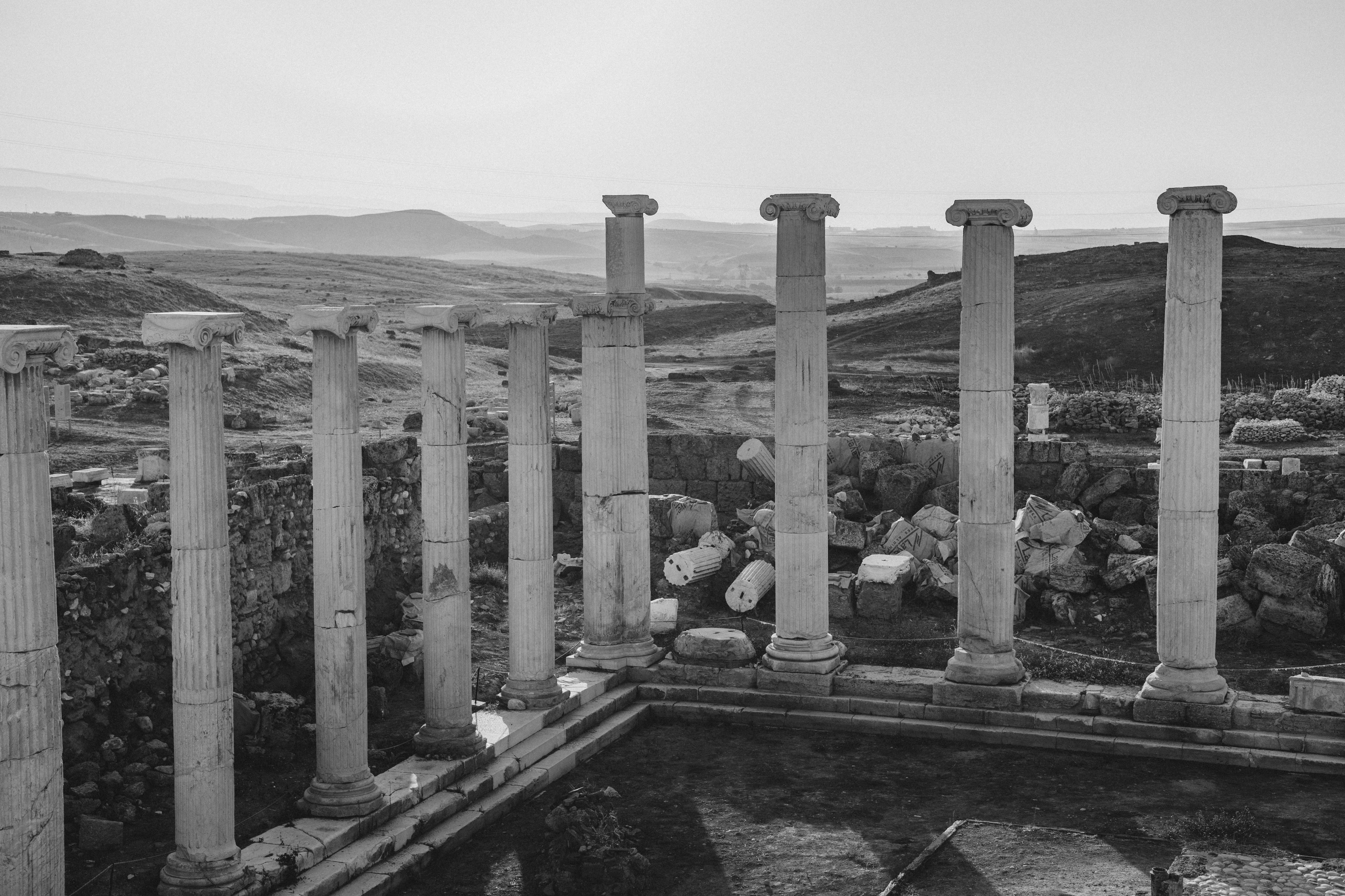 Grayscale Photo of Stone Pillars · Free Stock Photo