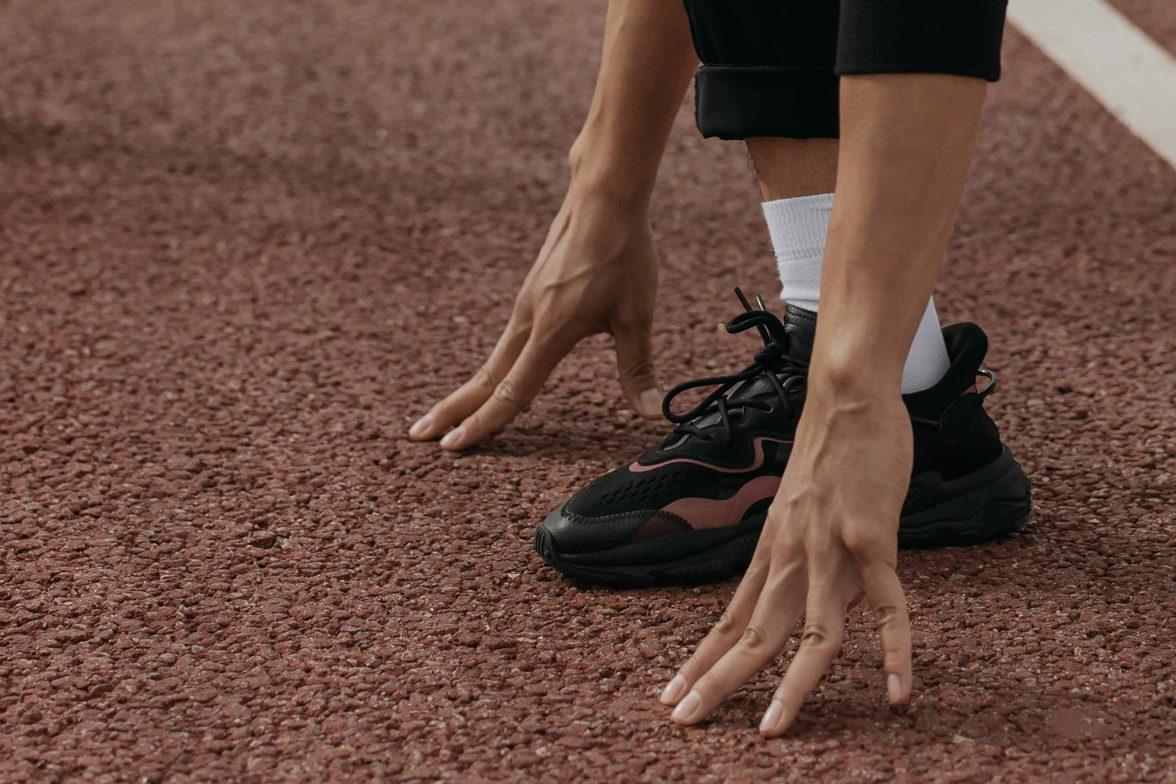 A Person in Black Running Shoes · Free Stock Photo