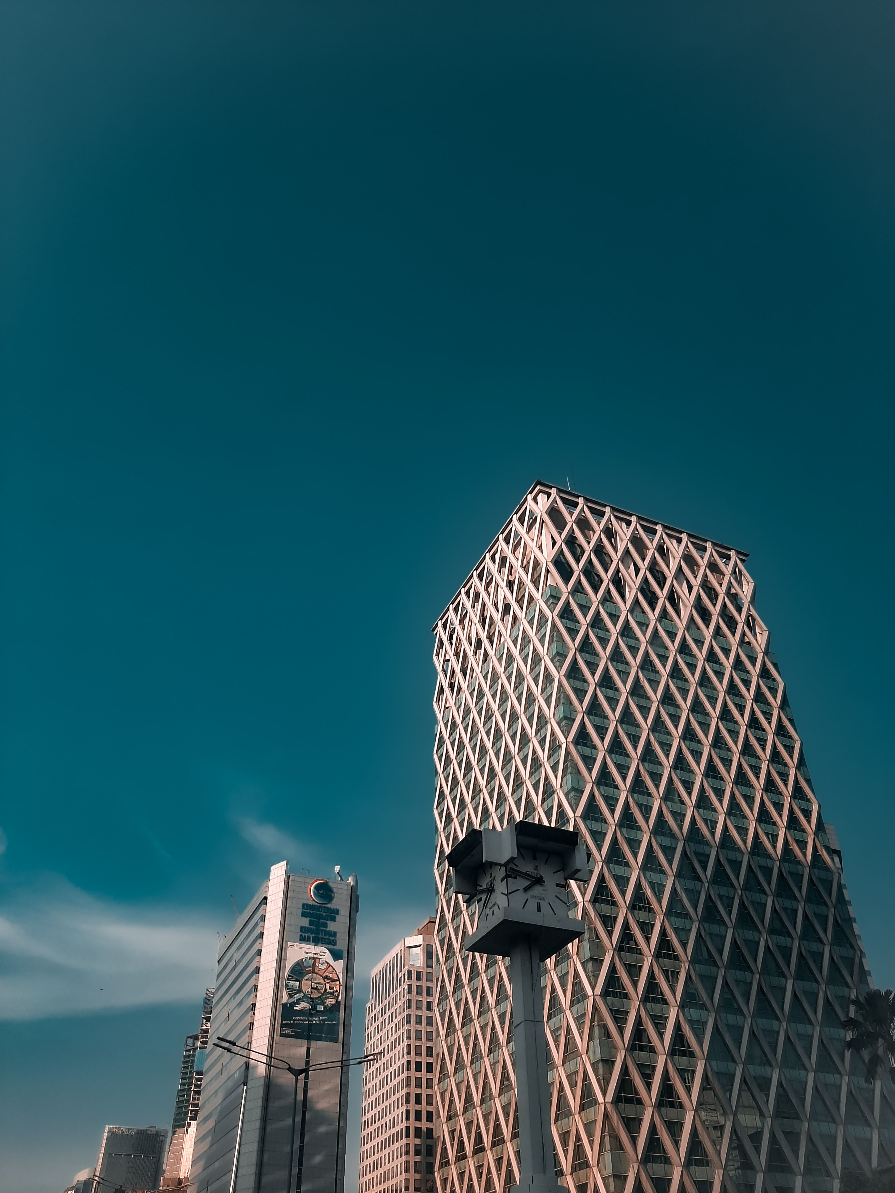 Gray High-rise Building Under Blue Sky · Free Stock Photo