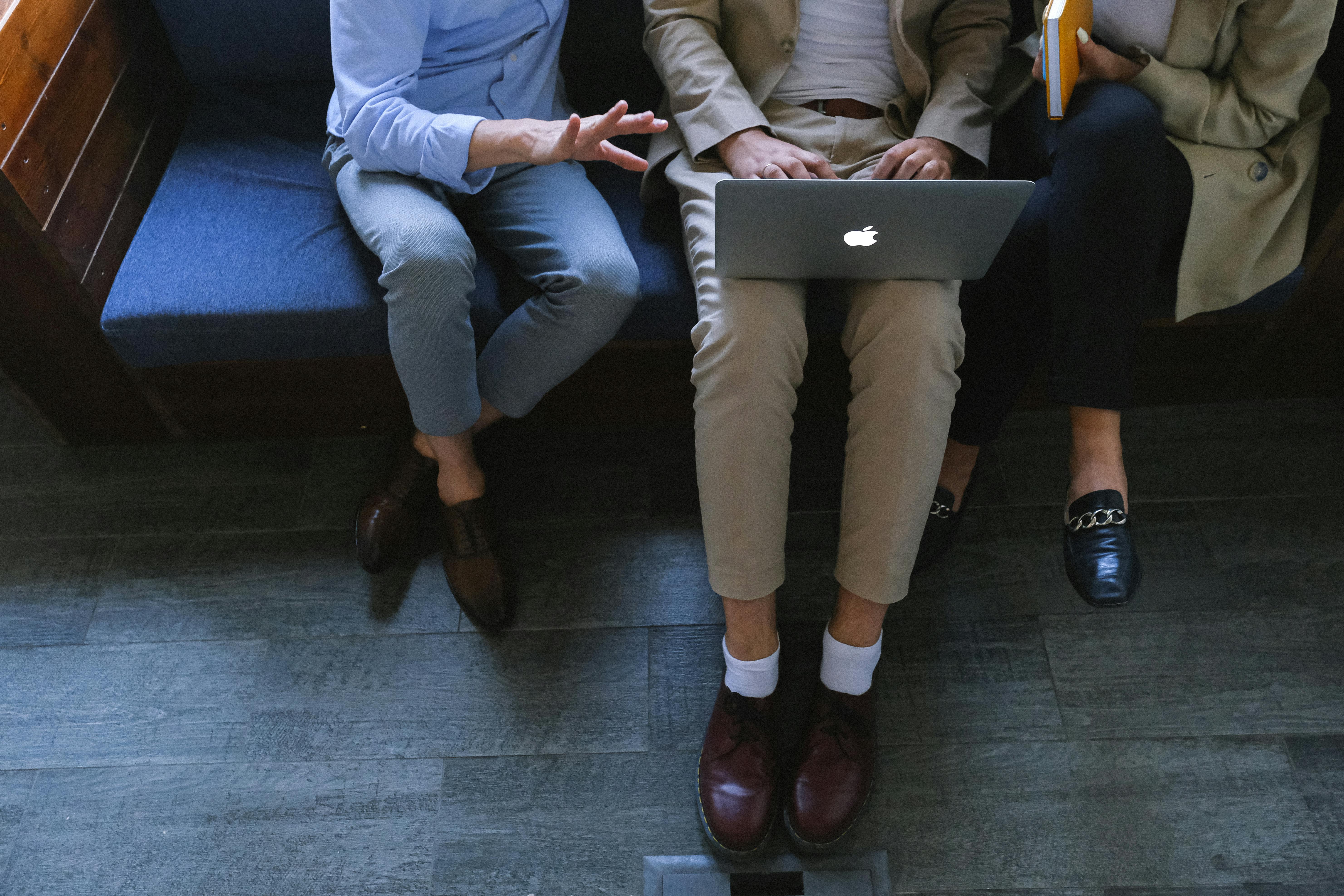 Three People Using Laptop together · Free Stock Photo
