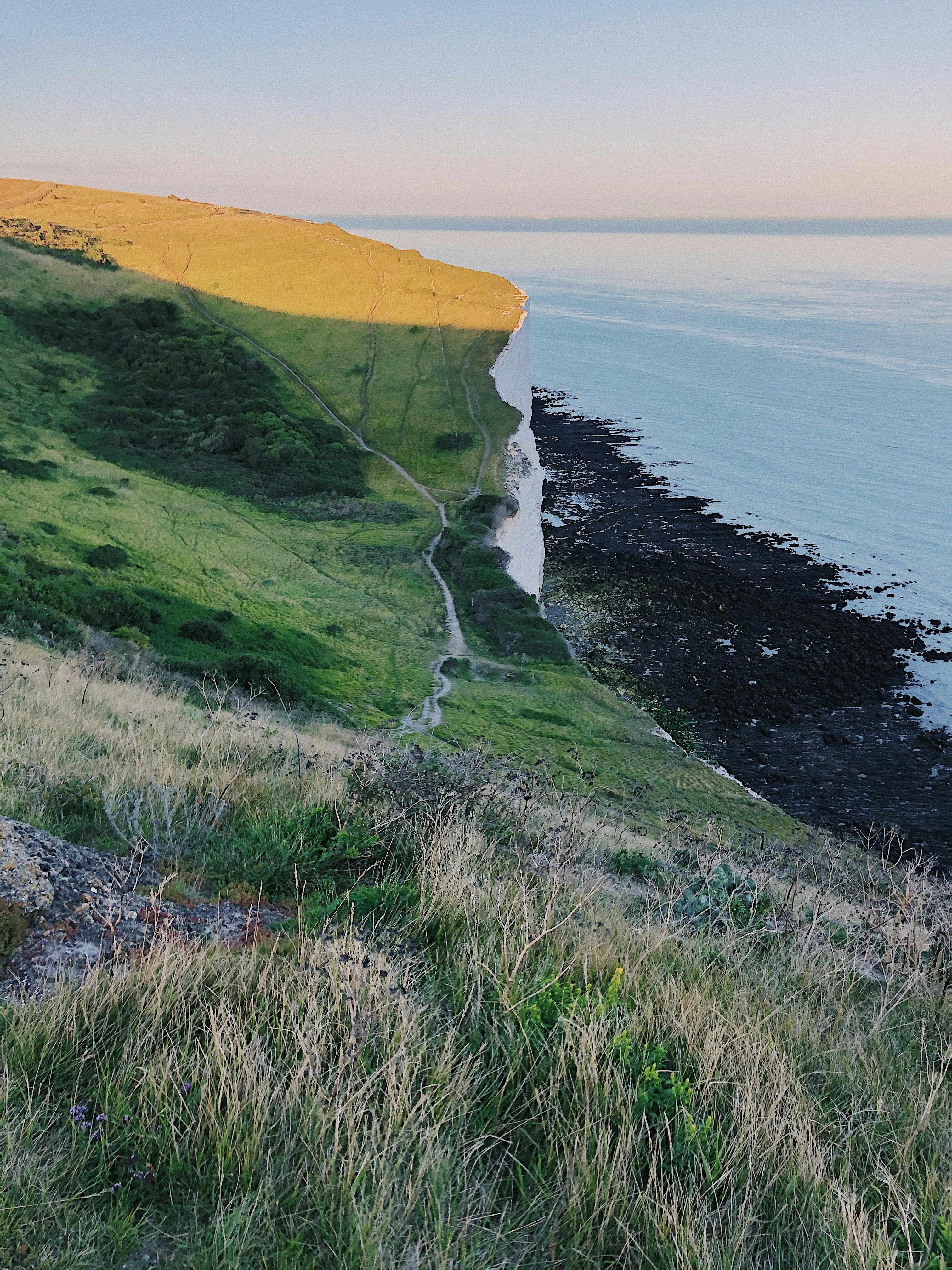 A Cliff Beside a Sea · Free Stock Photo