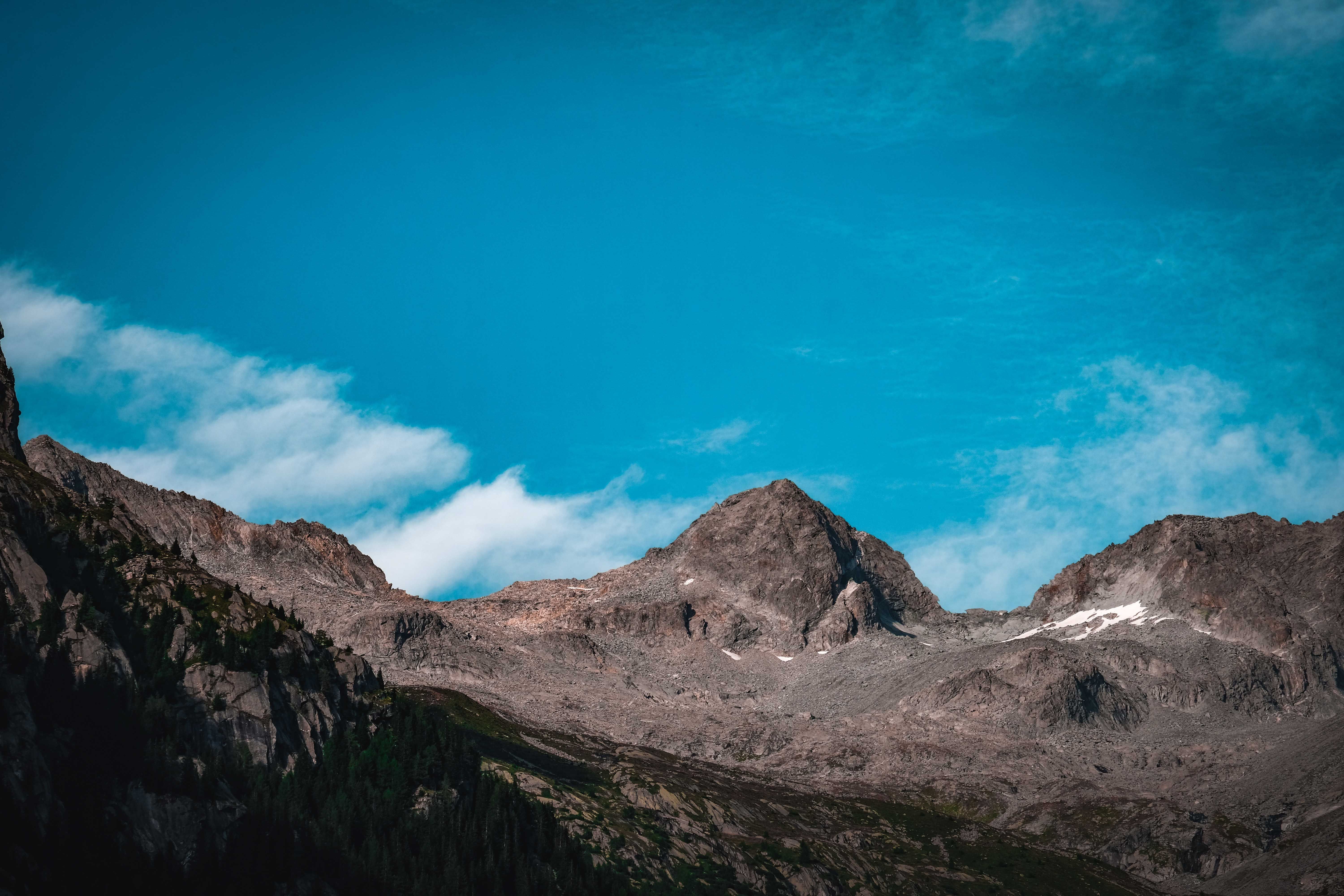 Severe rocky barren terrain in daylight · Free Stock Photo