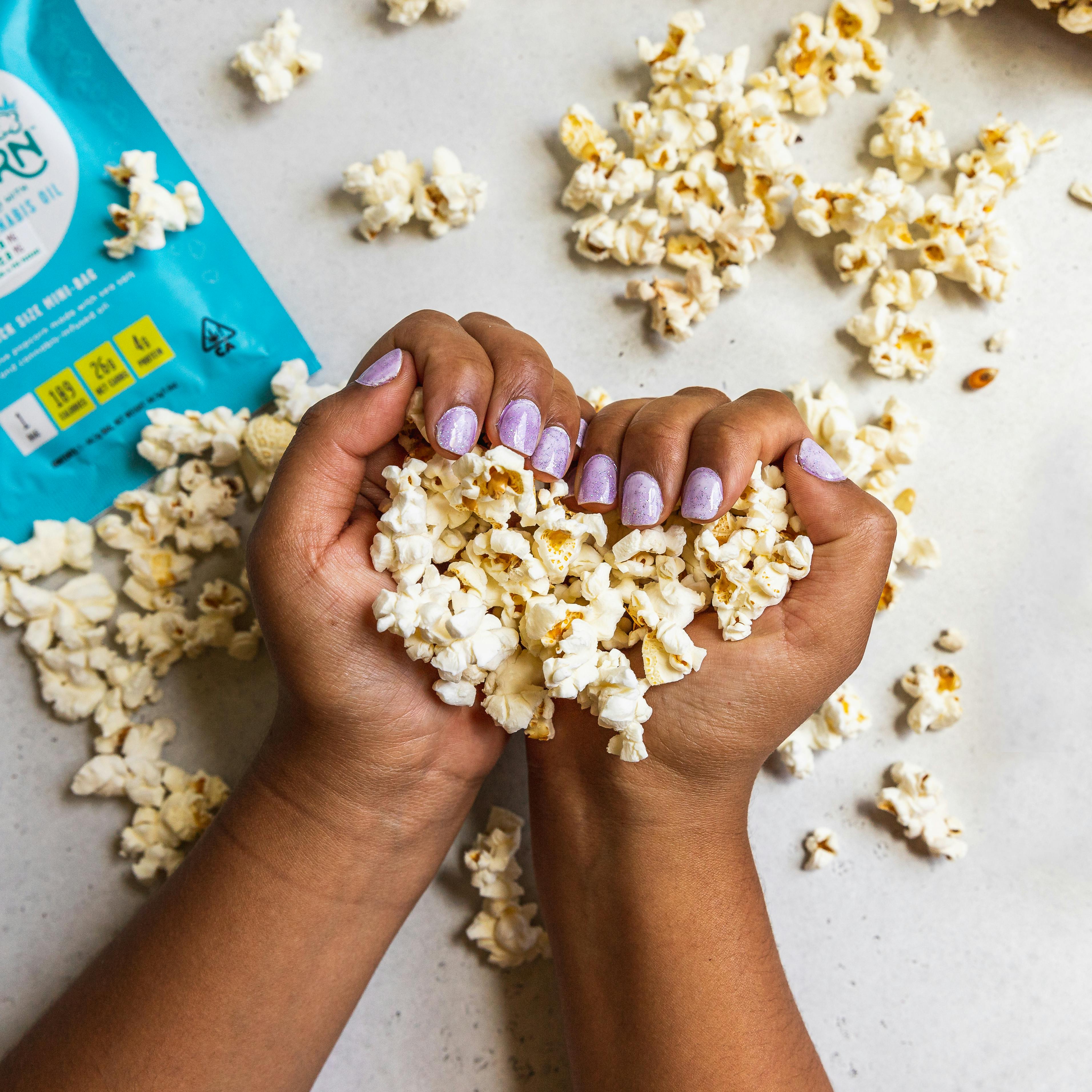 Person's Hands with Popcorns · Free Stock Photo