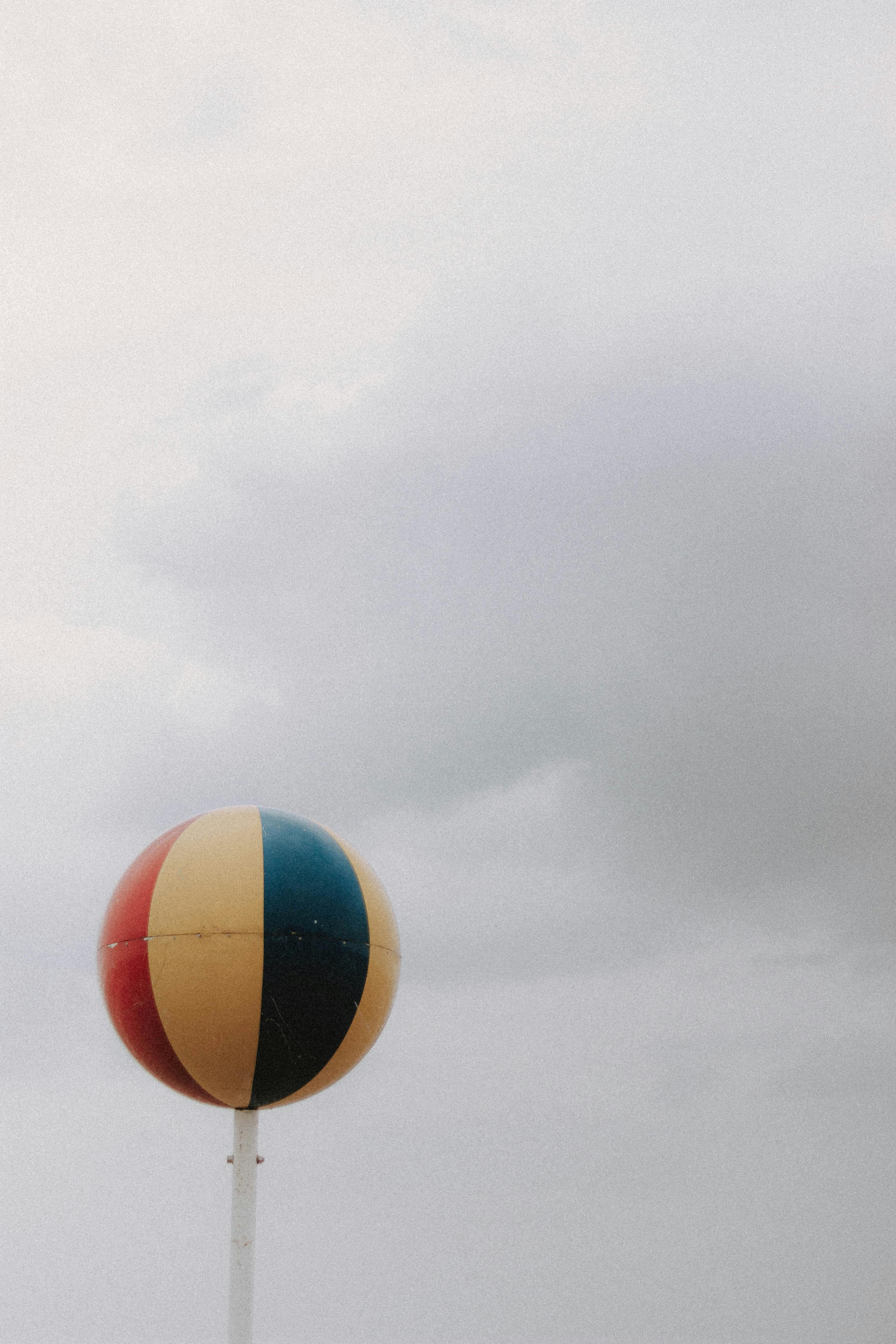 Colorful balloon located under cloudy sky · Free Stock Photo