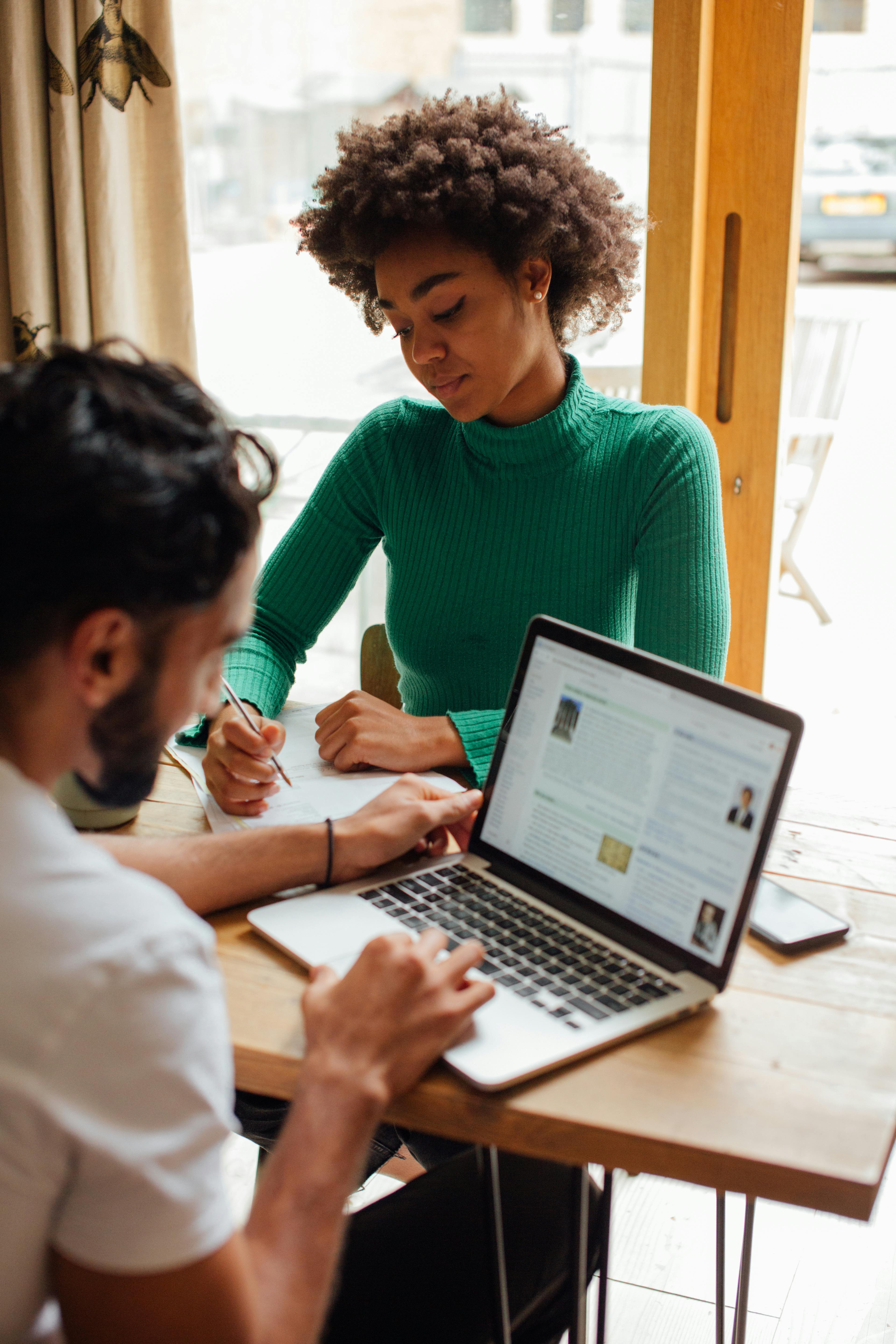 Photo Of Person Writing On Notepad · Free Stock Photo