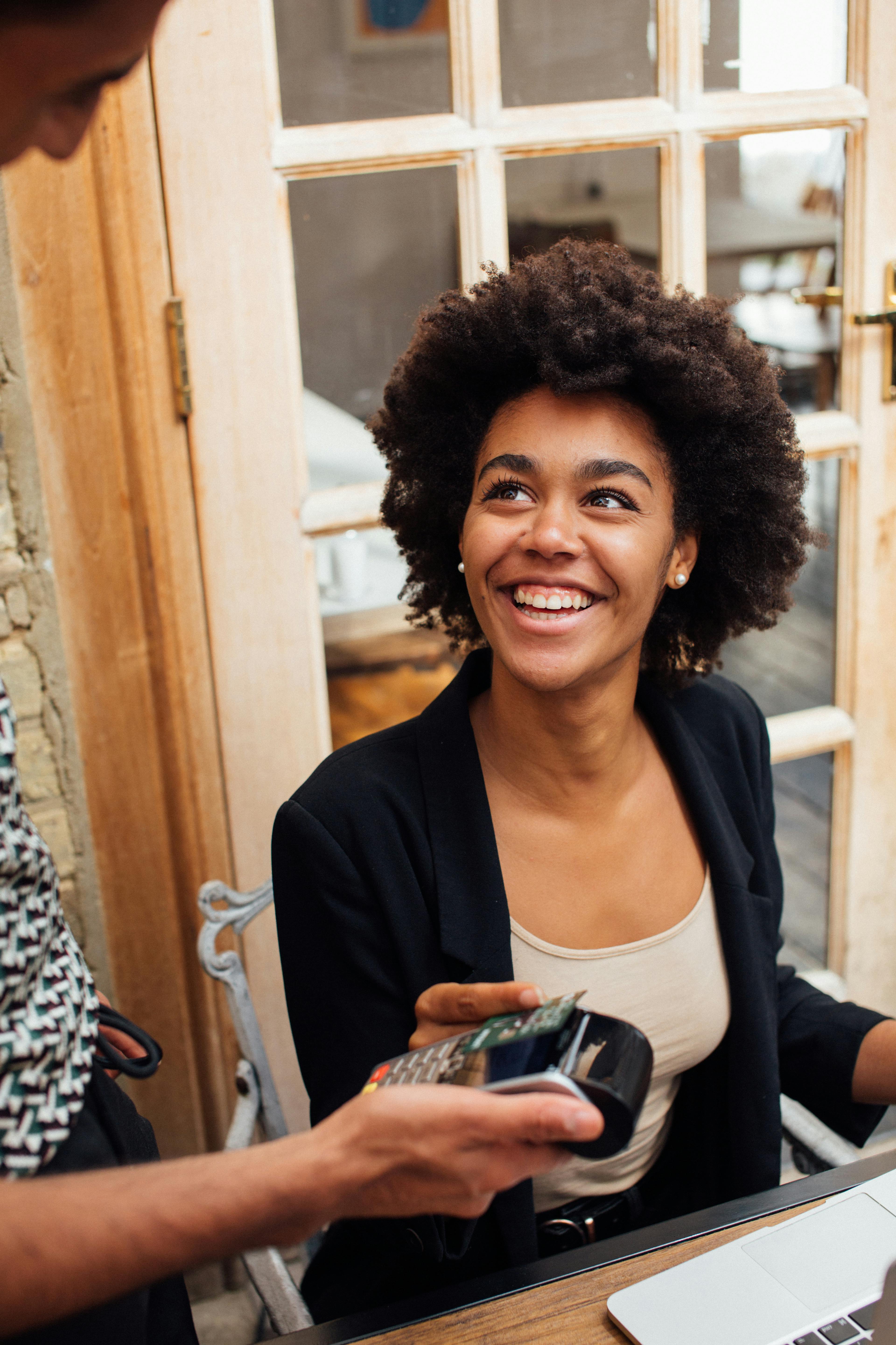 Woman Smiling at Work · Free Stock Photo