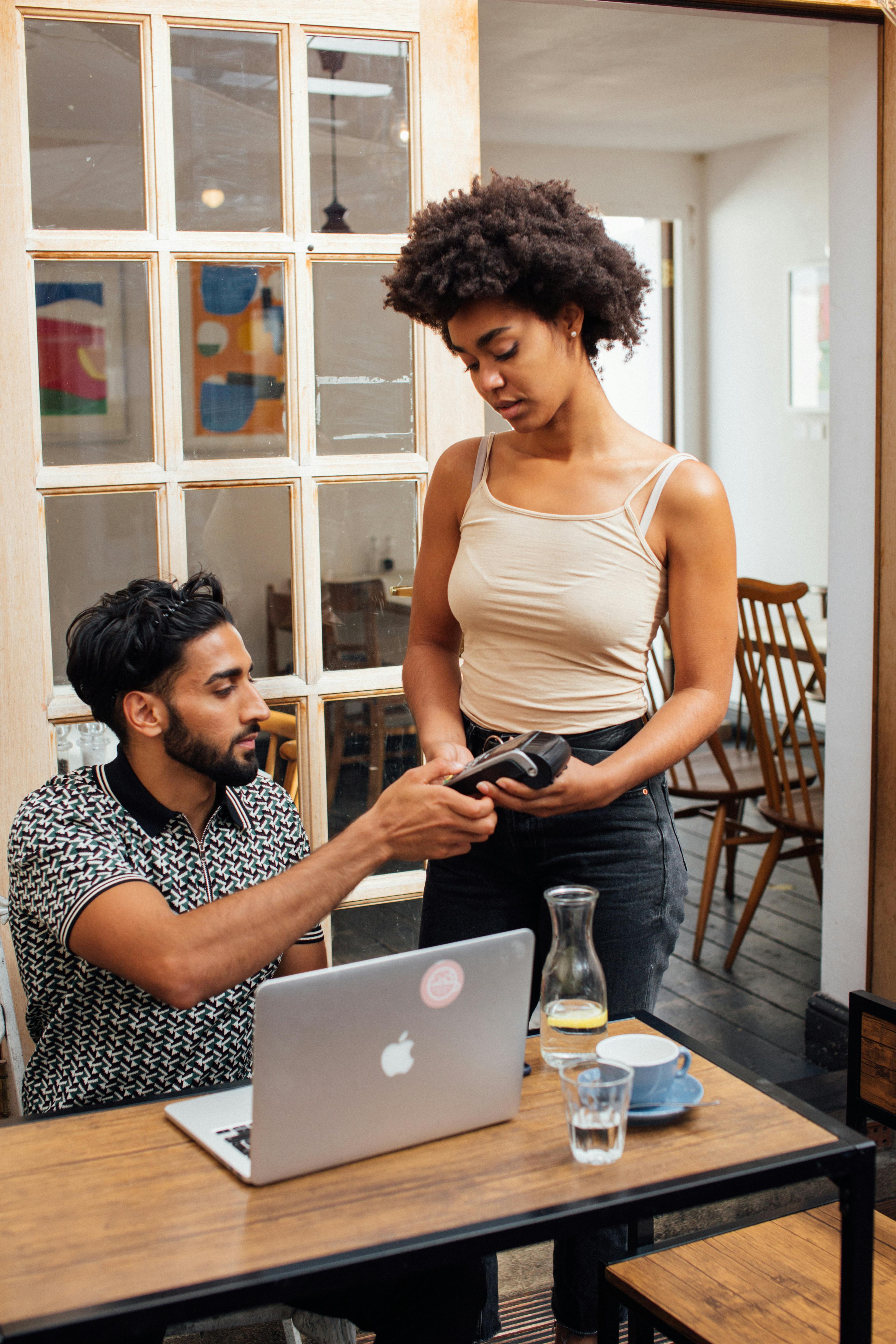 Couple Discussing Details at Work · Free Stock Photo