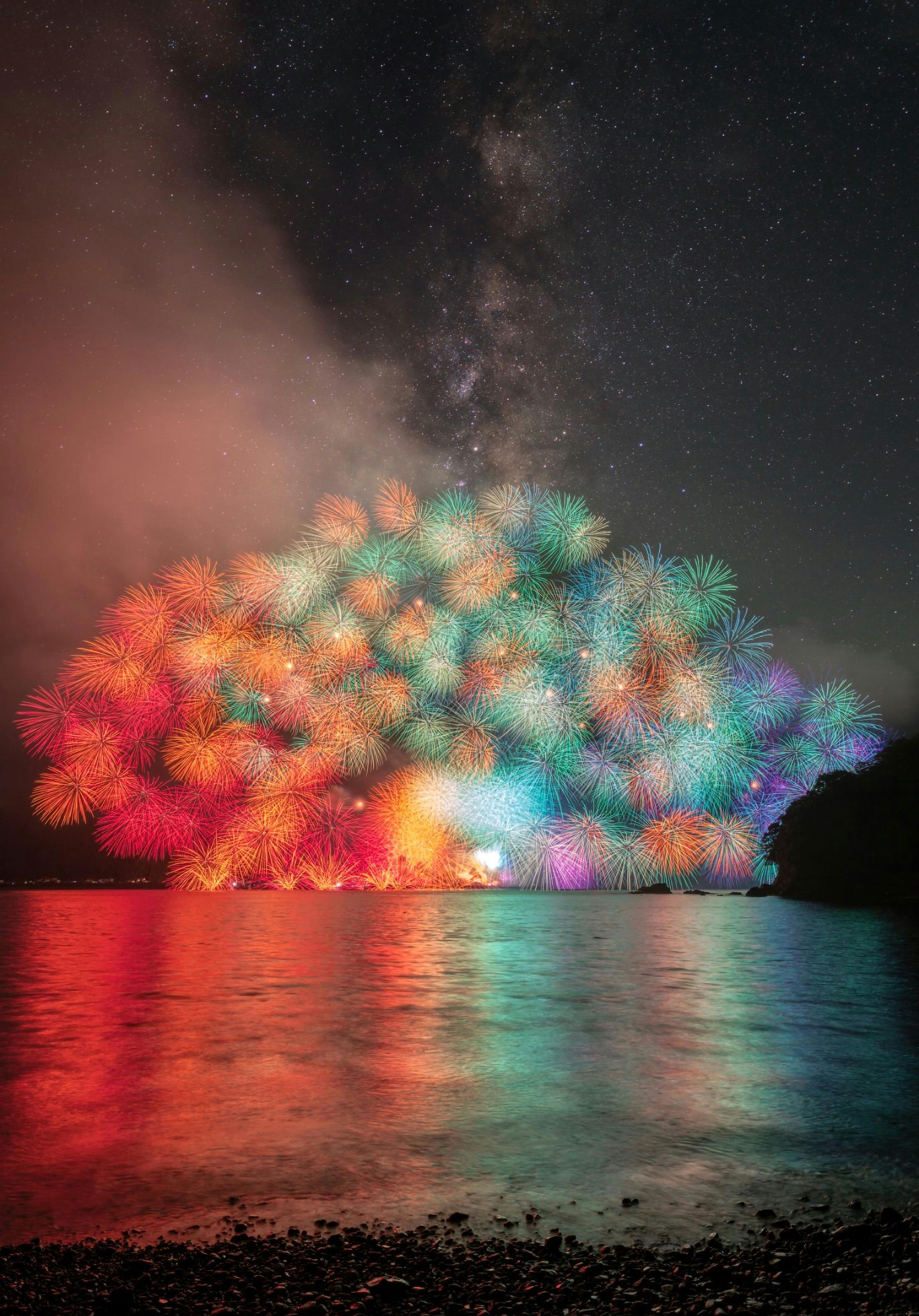 Vivid fireworks against Milky way in starry sky at night · Free Stock Photo