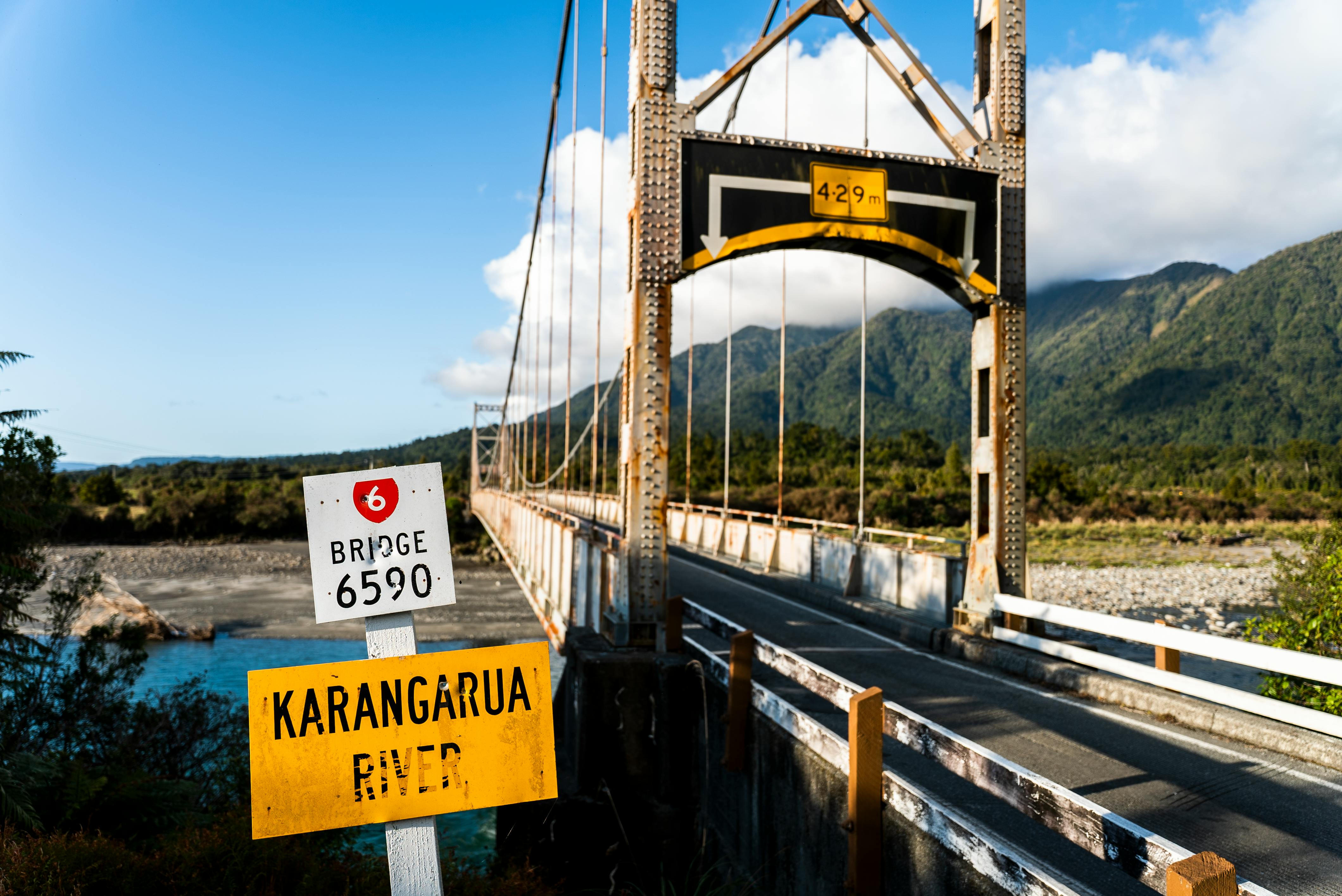 Yellow Road Signage Near the Bridge · Free Stock Photo