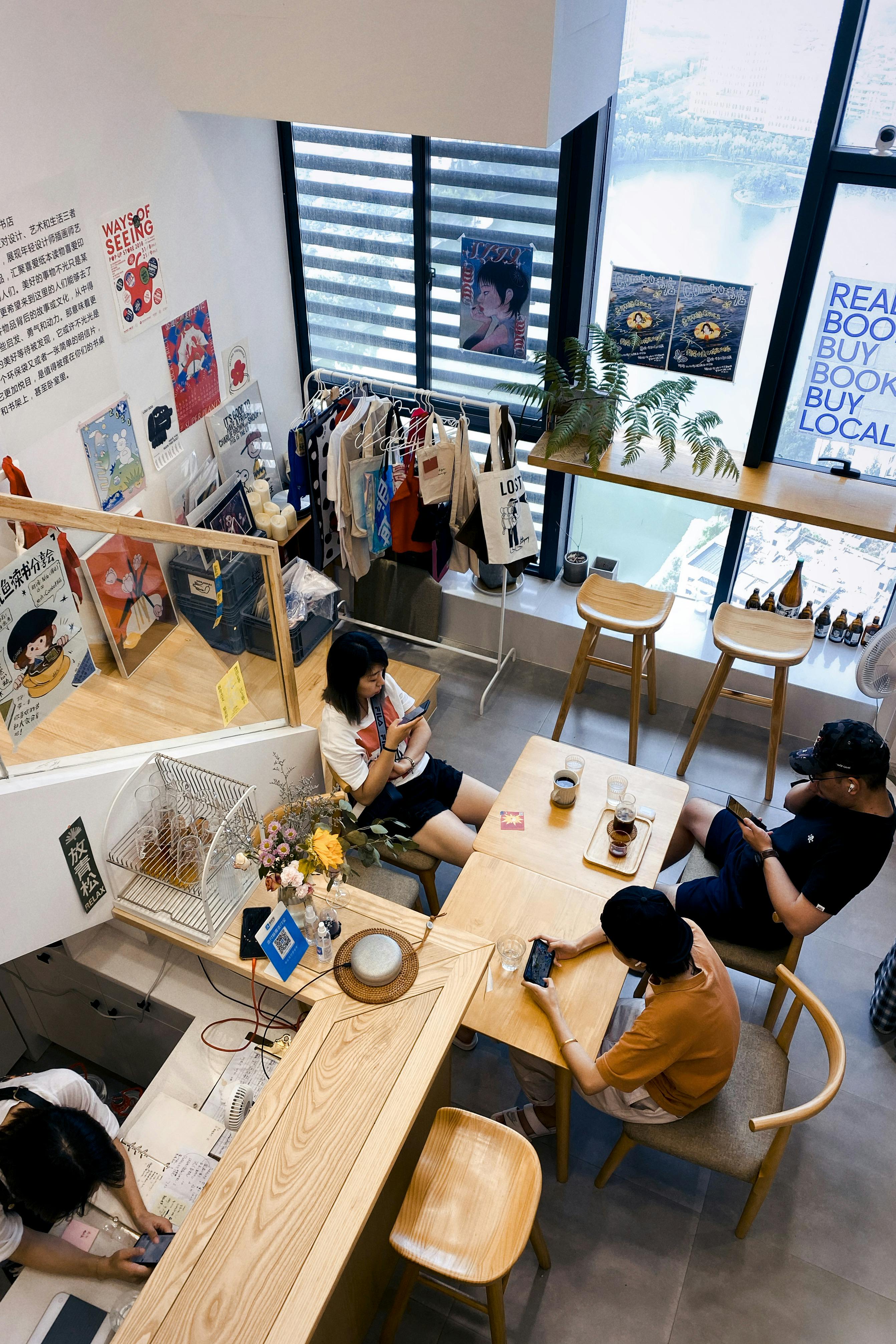 People Sitting Inside the Café while Using their Mobile Phones · Free ...