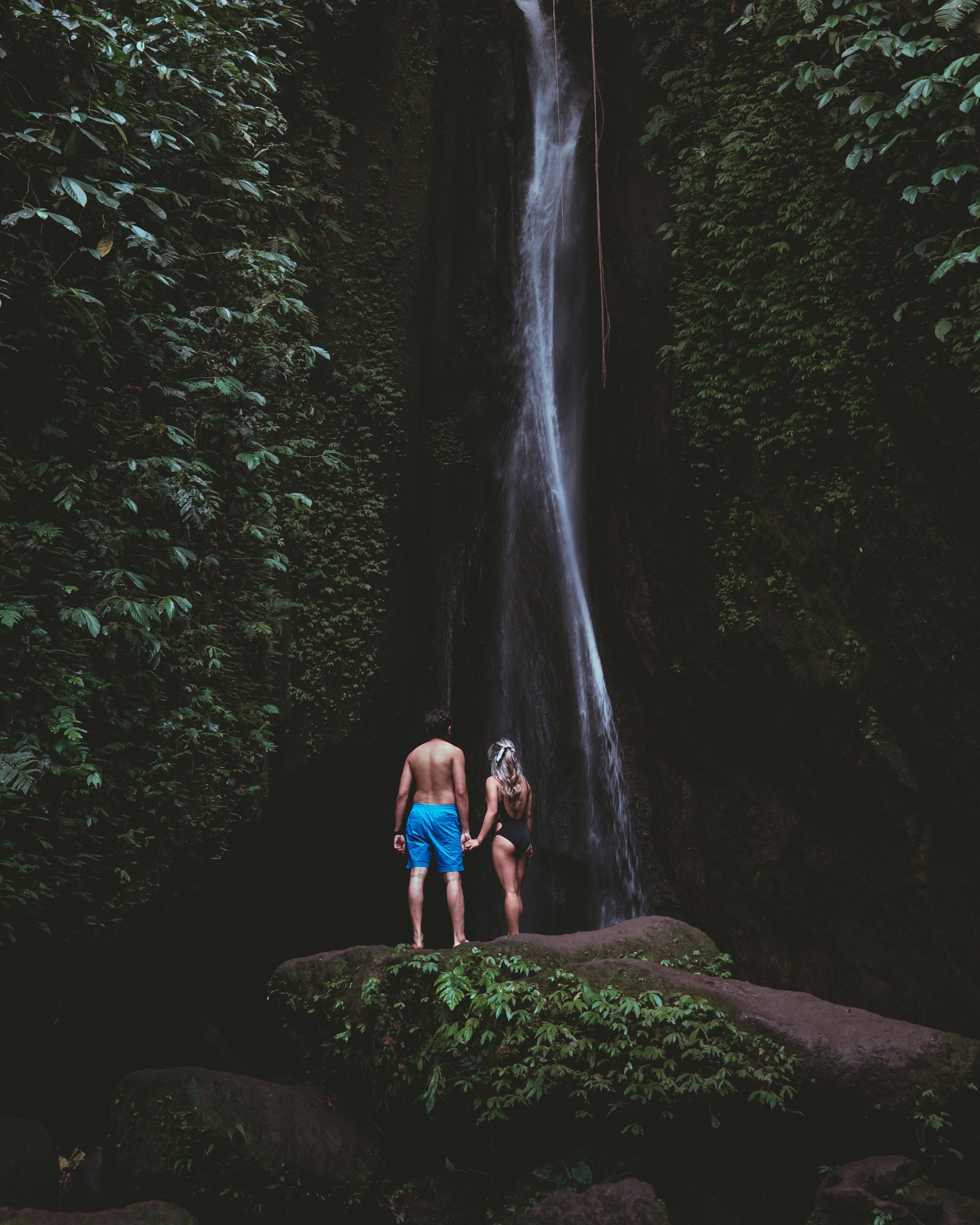 A Couple Holding Hands Near the Waterfalls · Free Stock Photo