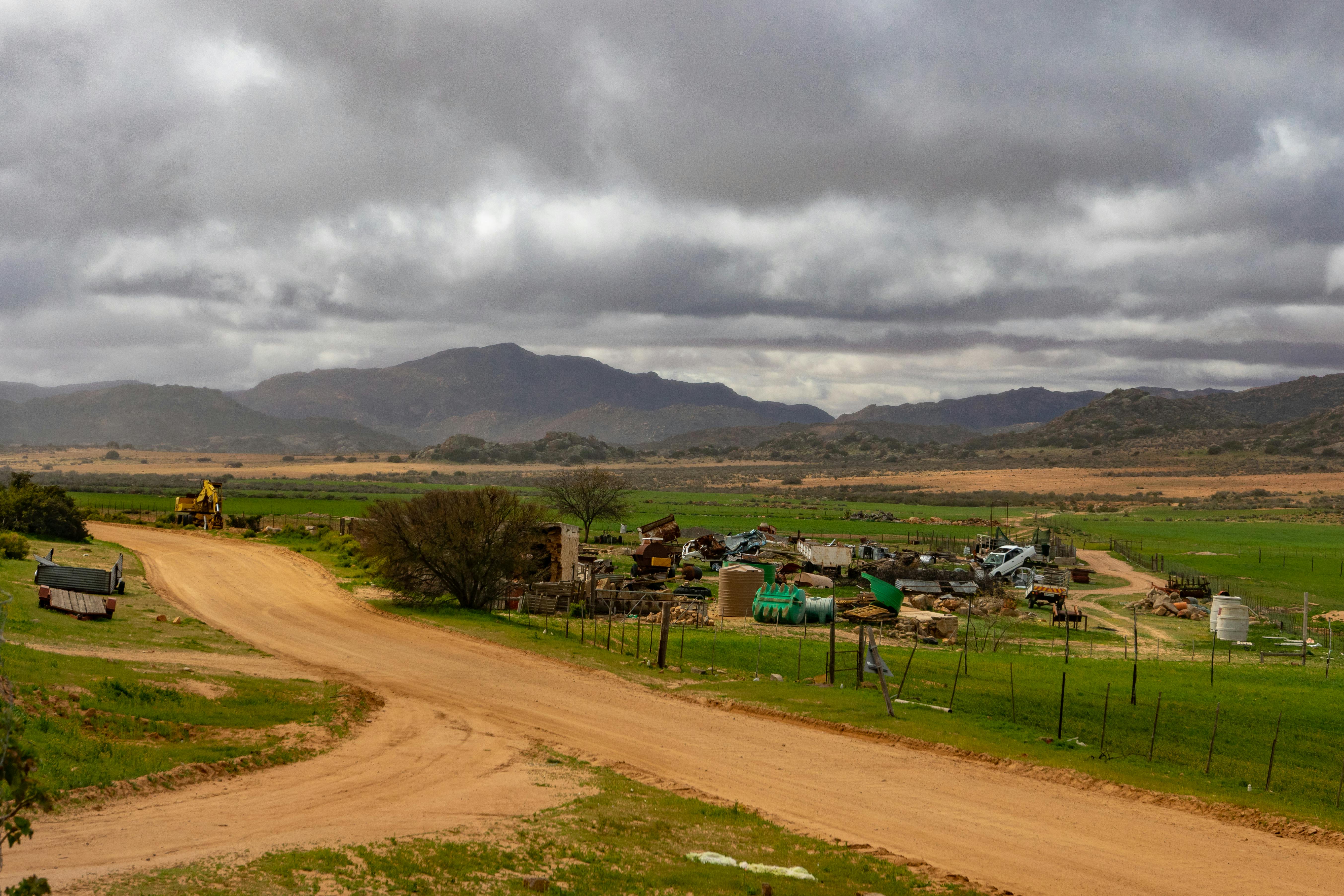 Gray Soil Road Near Field during Daytime Photo · Free Stock Photo